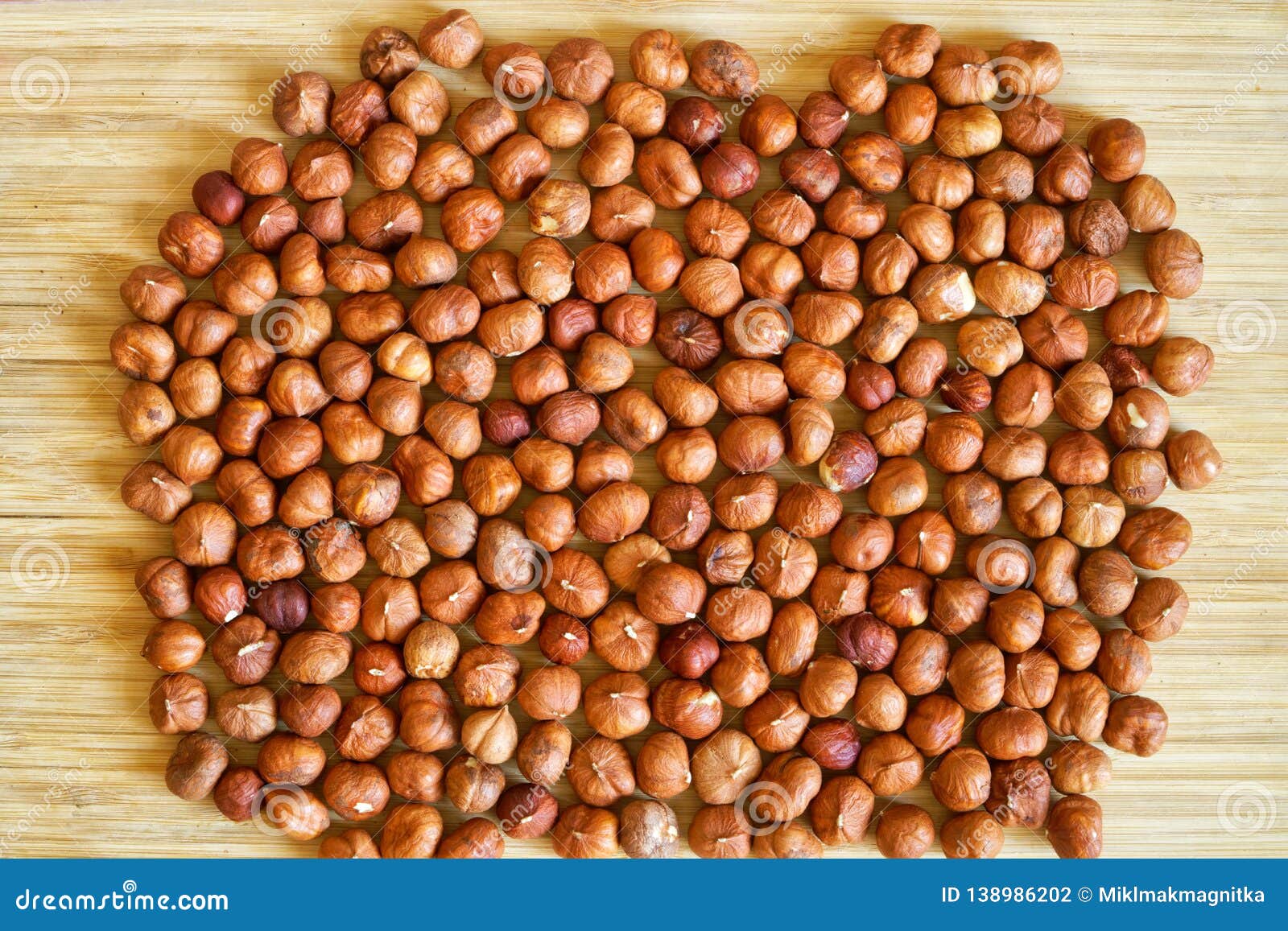 Hazelnut Nuts Lie on a Light Bamboo Surface Stock Photo - Image of ...