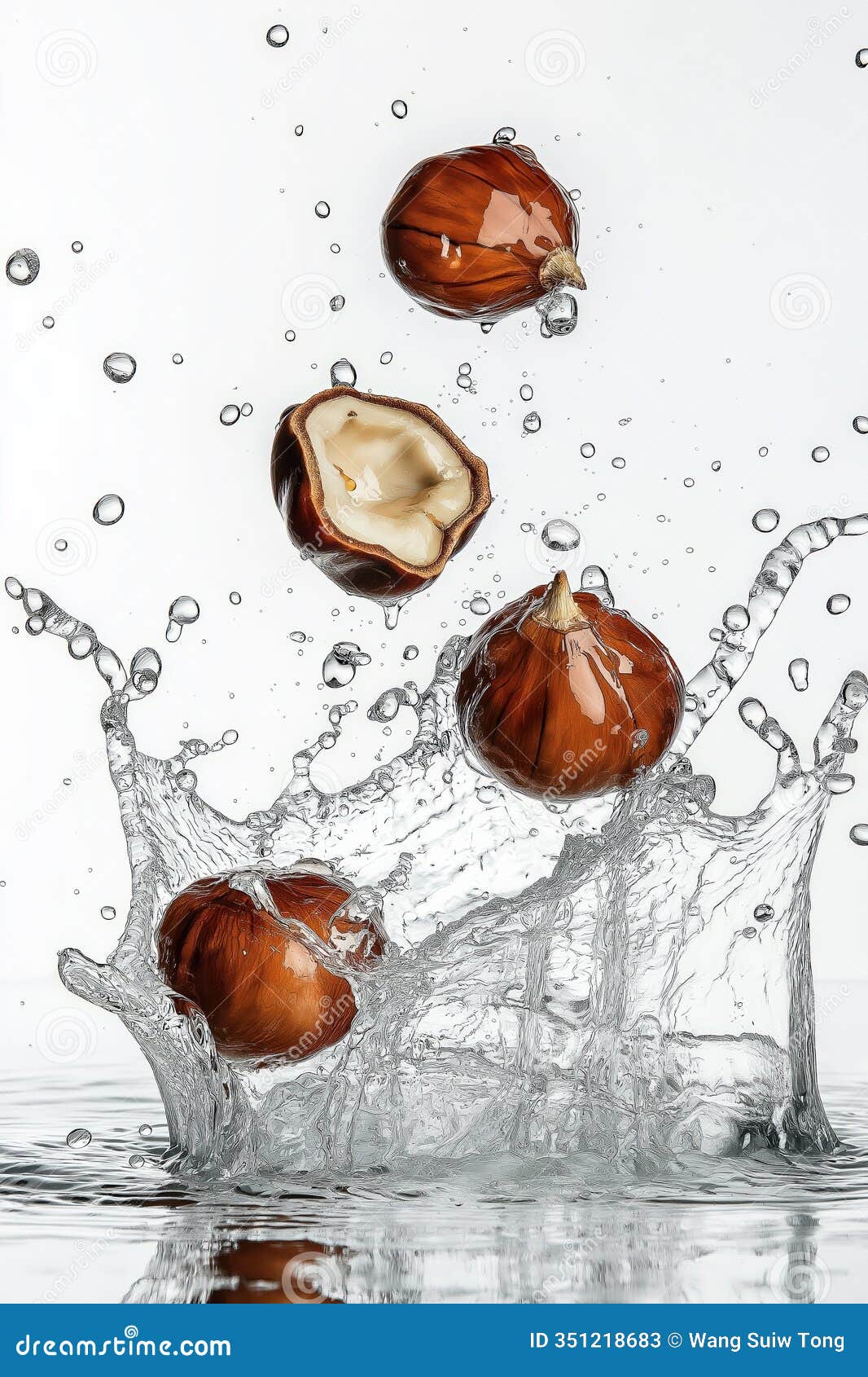 Hazelnuts Splashing into Water Creating a Refreshing Explosion Stock ...
