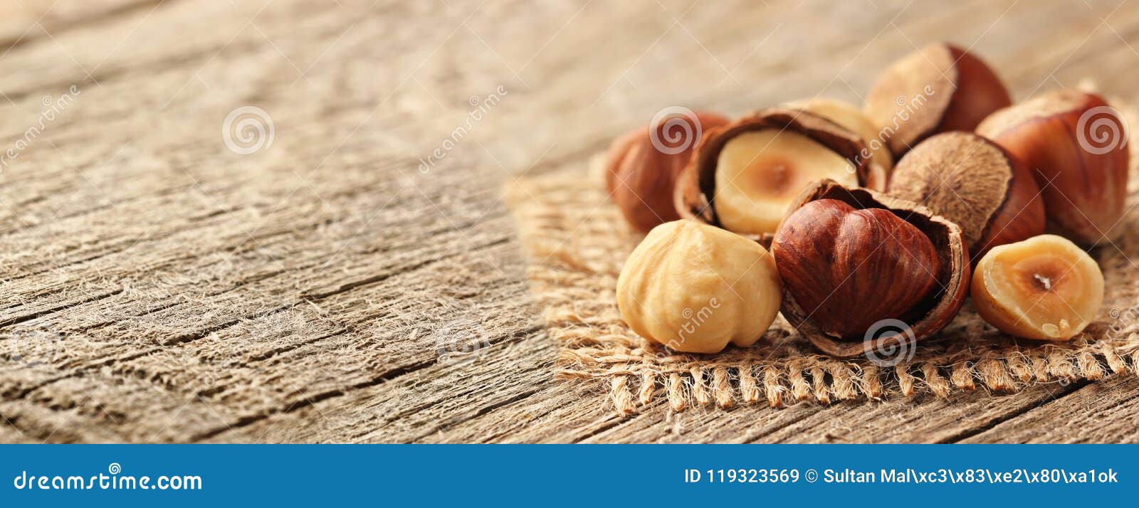 Hazelnuts on wooden table stock image. Image of group - 119323569