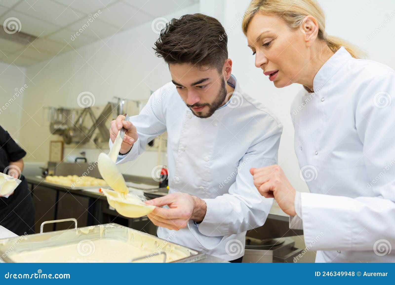 Head Chef with Apprentice in Kitchen Stock Photo - Image of female ...