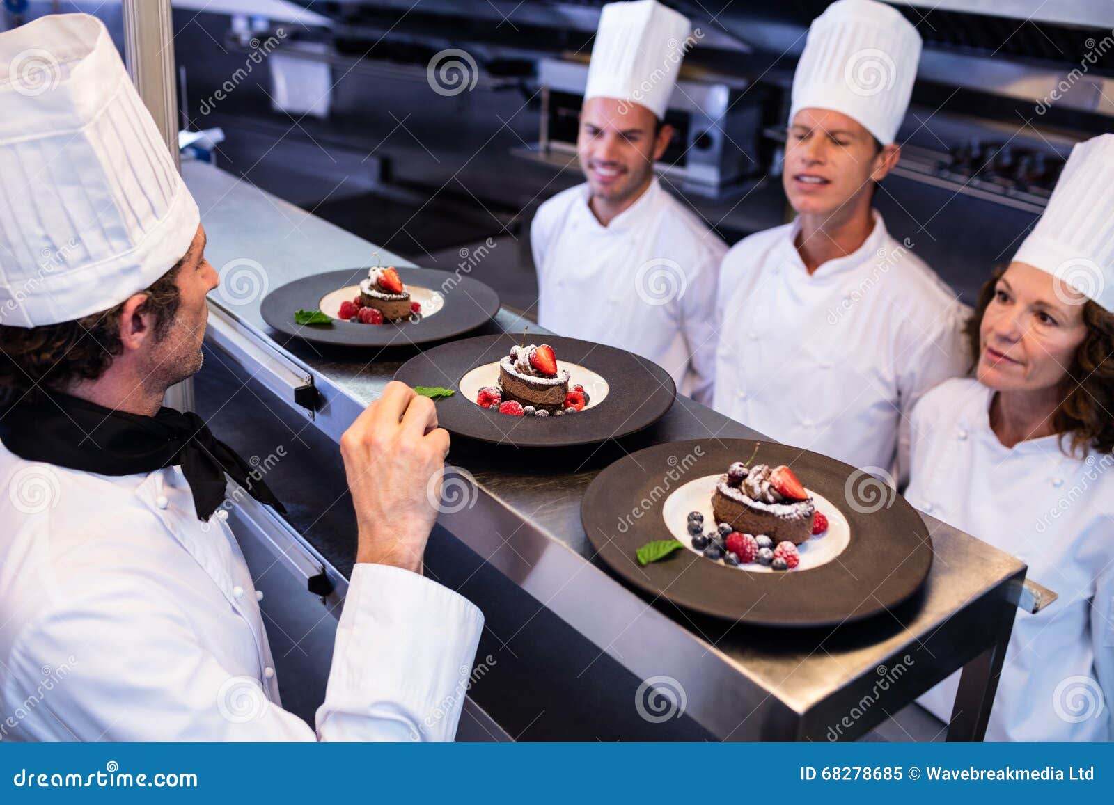 Head Chef Inspecting Dessert Plates on at Order Station Stock Image ...