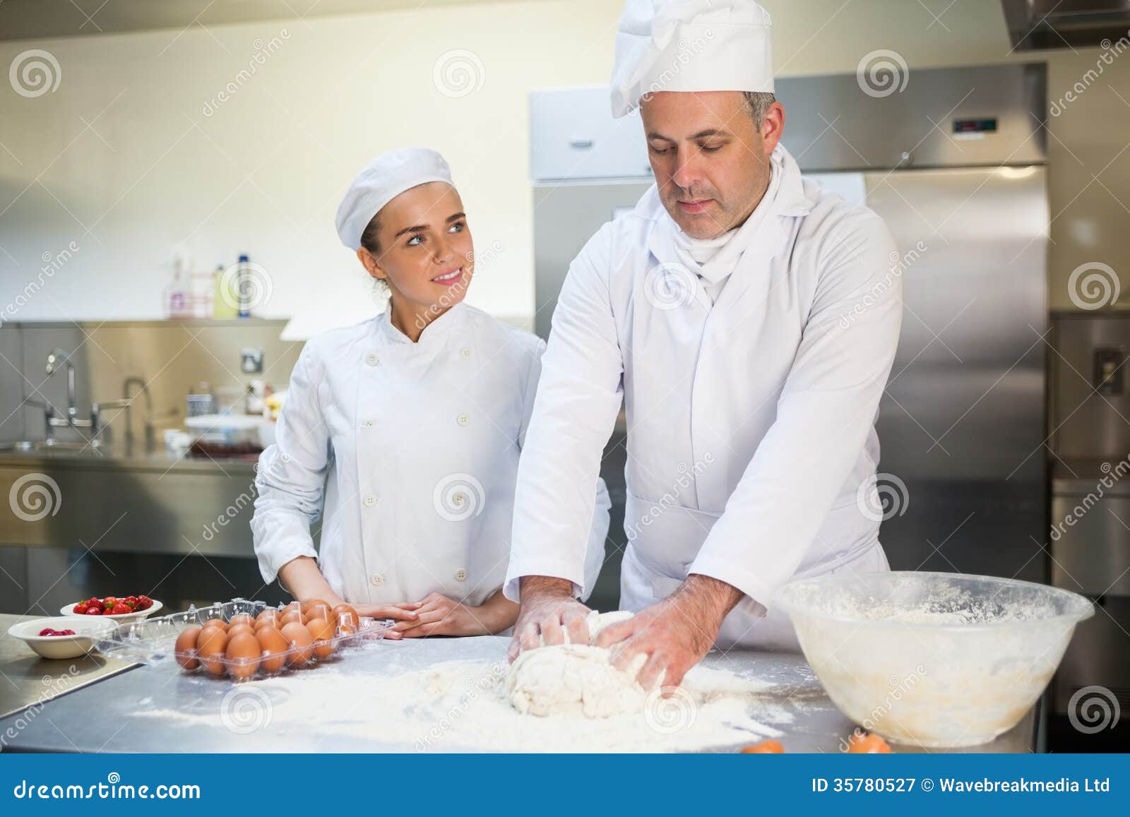 Head Chef Showing Happy Trainee How To Prepare Dough Stock Image ...