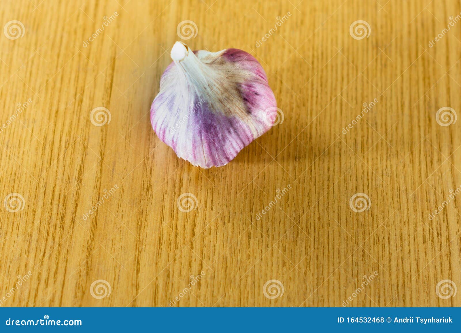 Head of Dried Blue Garlic on a Brown Background Stock Photo - Image of ...