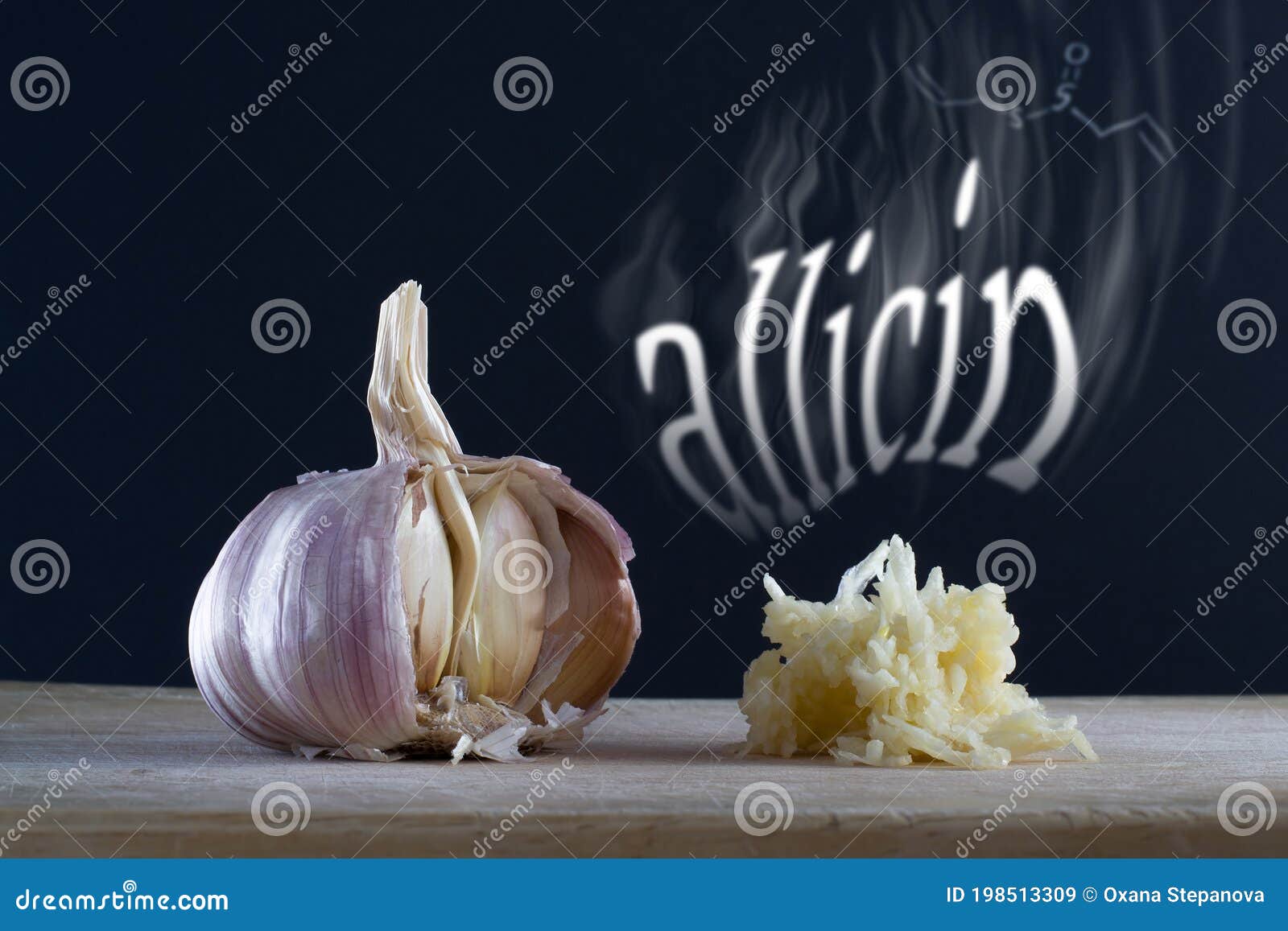 A Head of Garlic and a Pressed Garlic Releasing Allicin Against Black ...