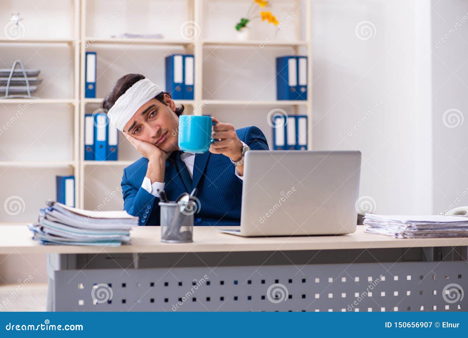 The Head Injured Male Employee Working in the Office Stock Image ...