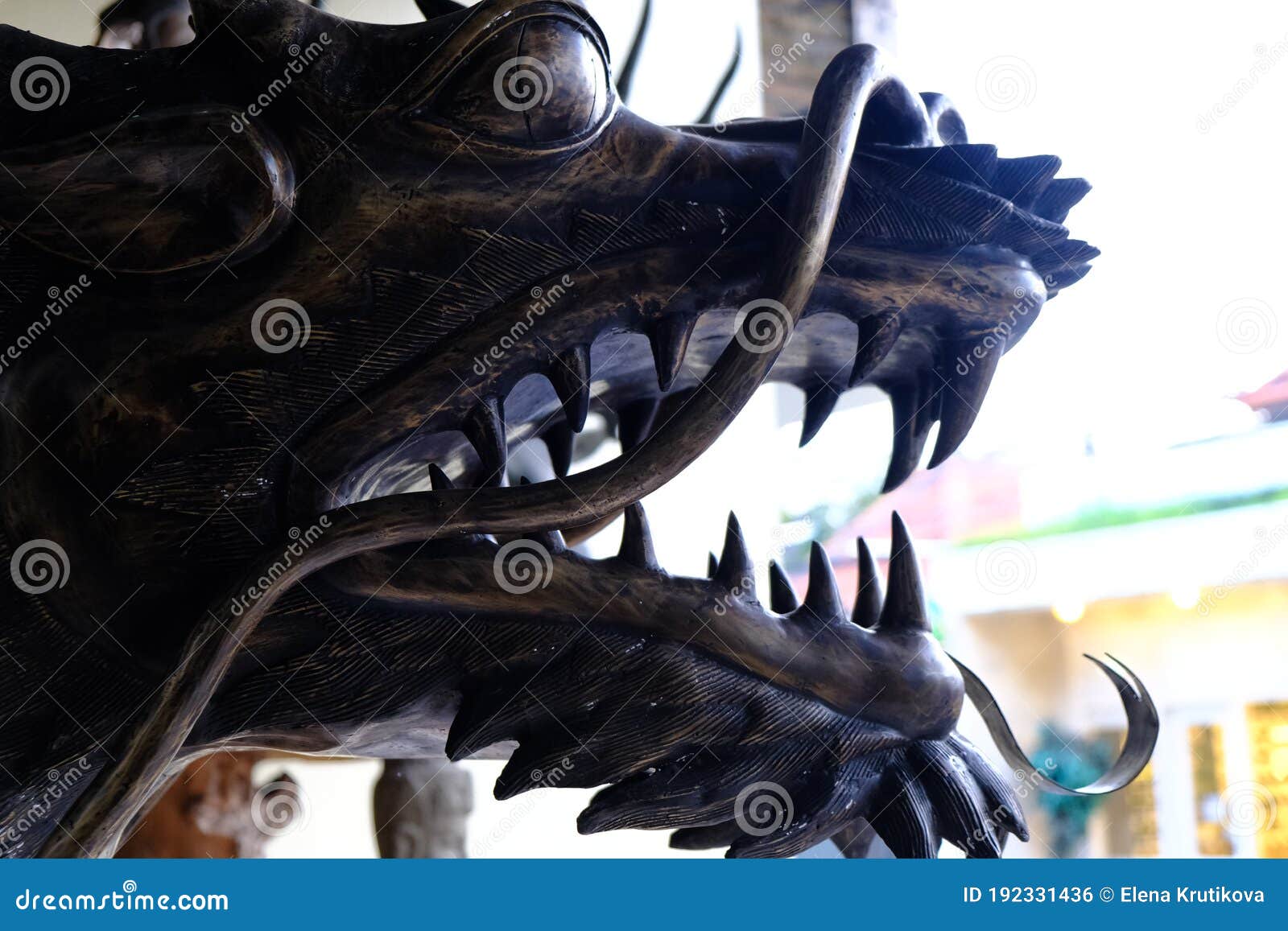 The Head of an Iron Sculpture of a Dragon with Sharp Teeth. Stock Photo ...