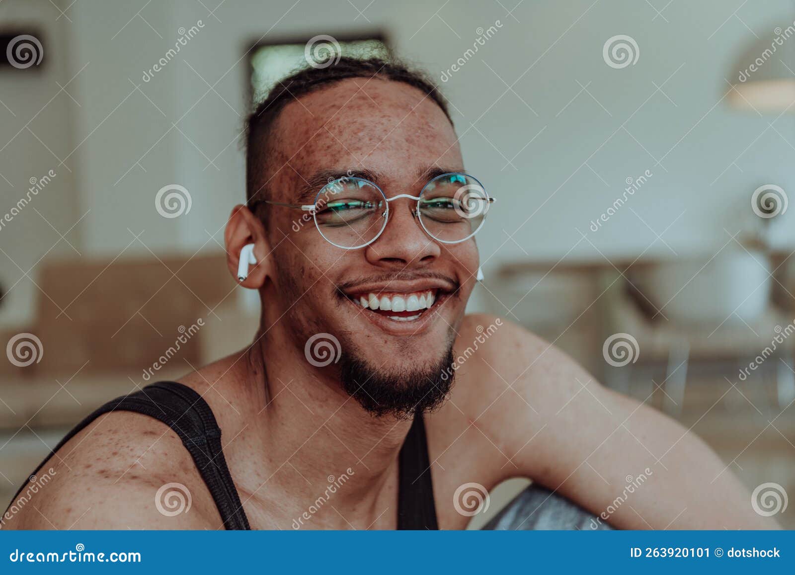 Head Shot Of African American Man Wearing Glasses And Headphones