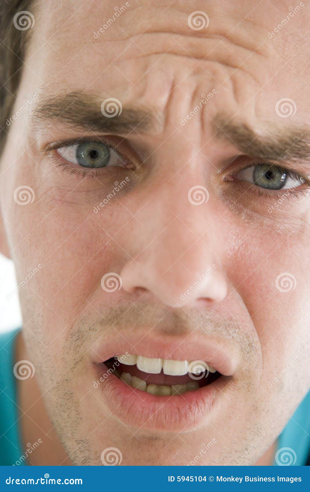 Head shot of man scowling stock photo. Image of emotion - 5945104