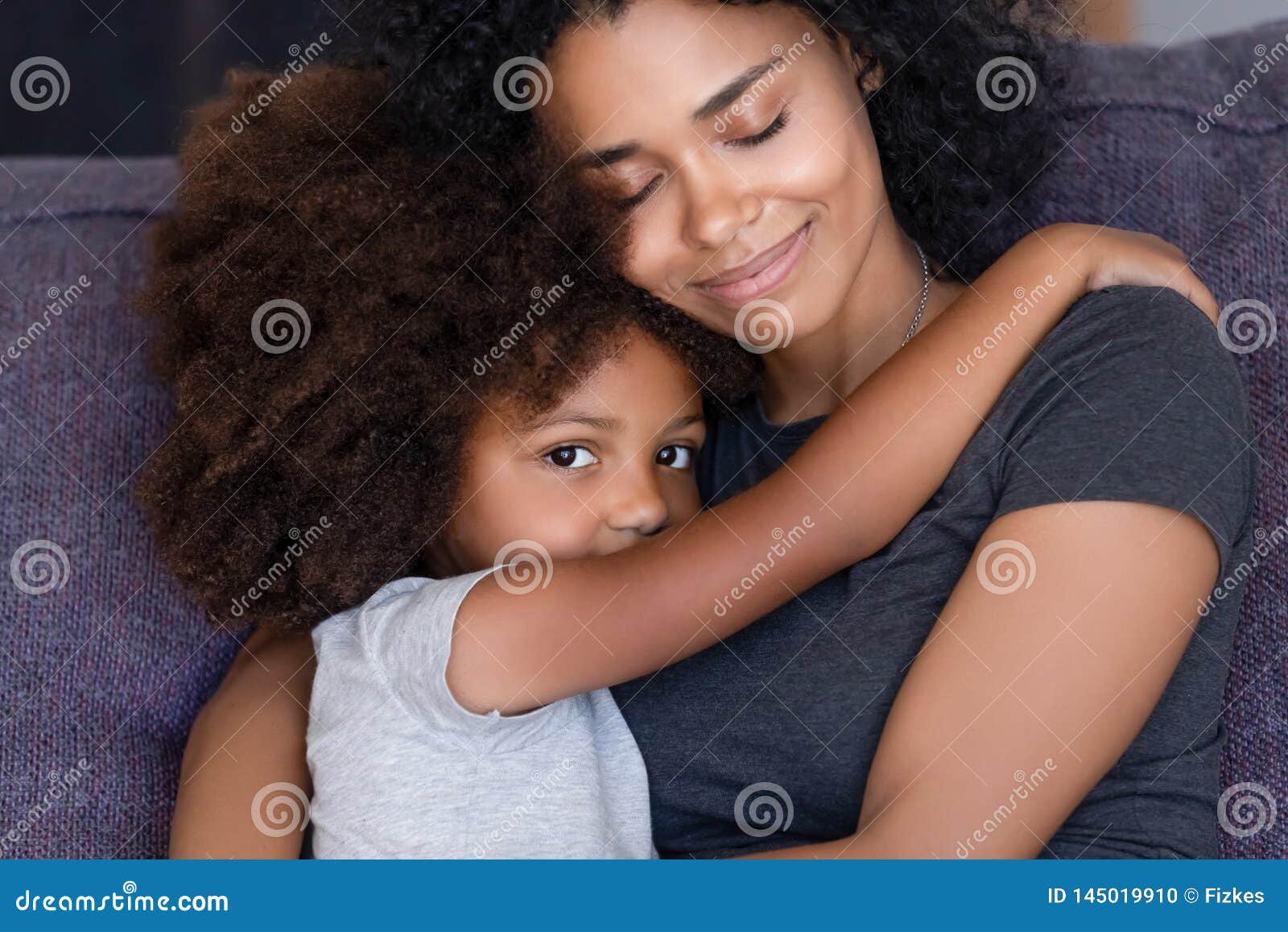 Head Shot Portrait African American Mother Embracing Daughter Stock