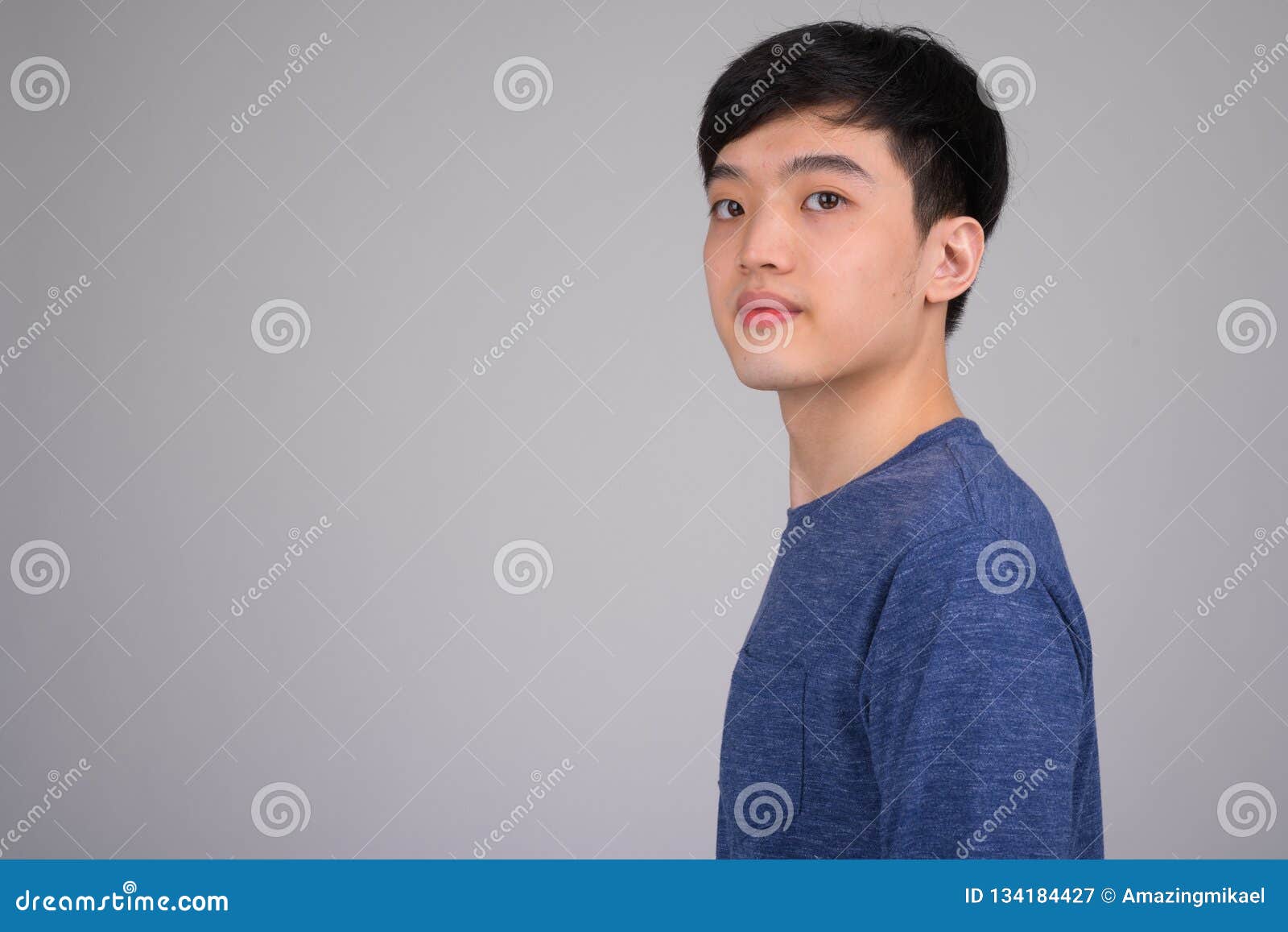 Head Shot Profile View of Young Asian Man Looking at Camera Stock Image ...