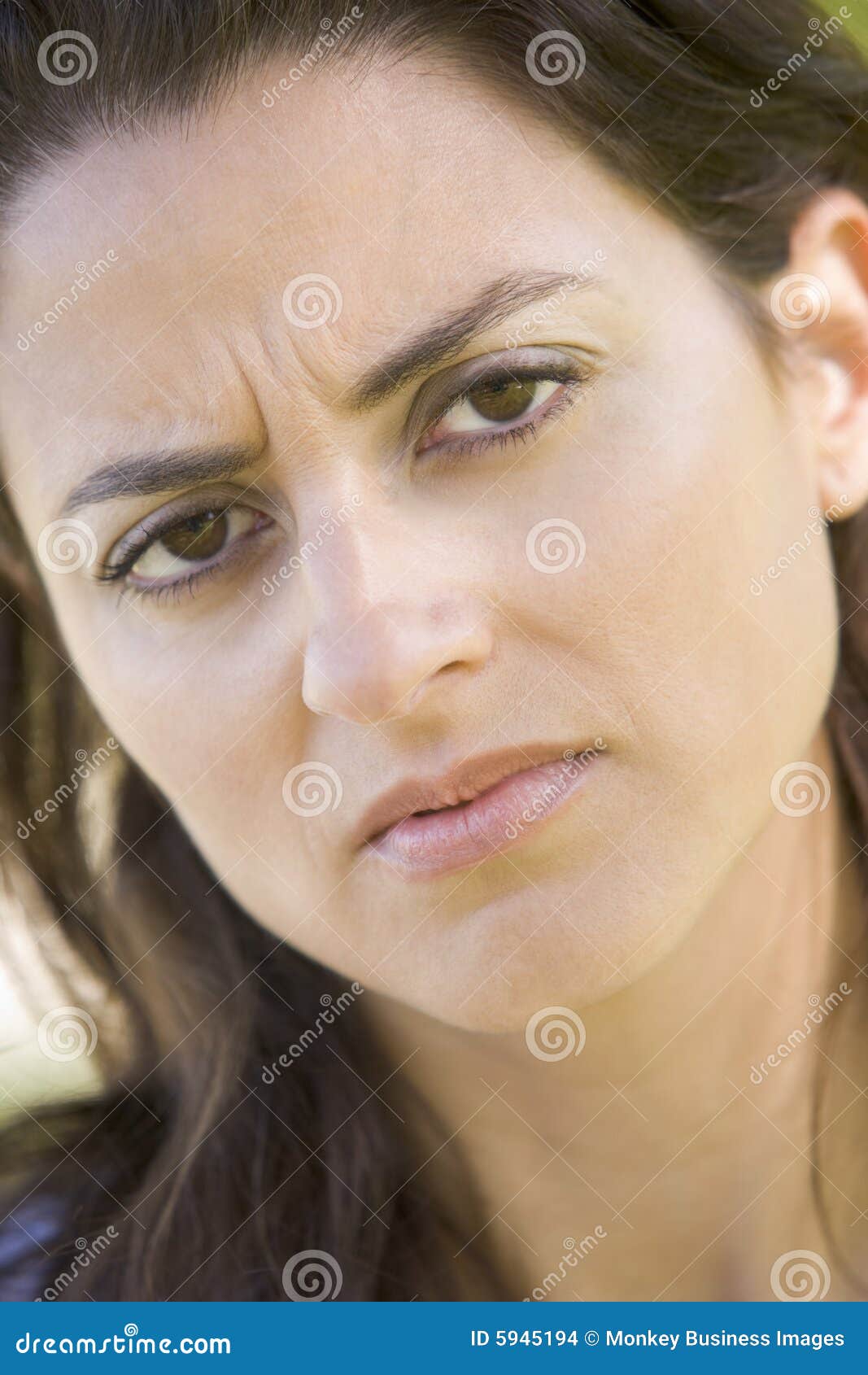 Head Shot of Woman Scowling Stock Photo - Image of camera, shoulders ...