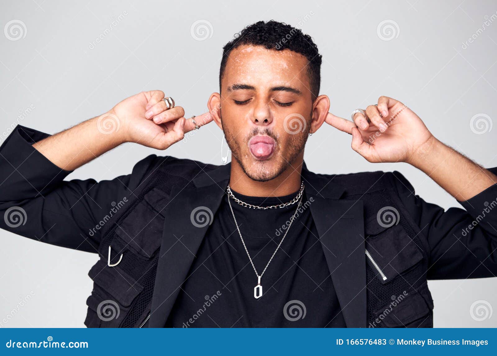 Head and Shoulders Studio Shot of Man Pulling Faces and Smiling at ...