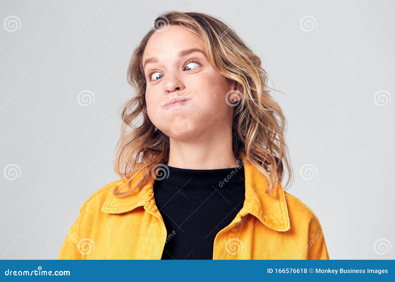 Head and Shoulders Studio Shot of Woman Pulling Faces and Smiling at ...
