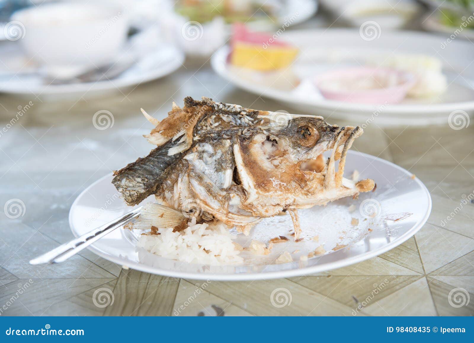 Head Skeleton of Fried Fish on Dish, it`s Delicious Food Stock Image ...