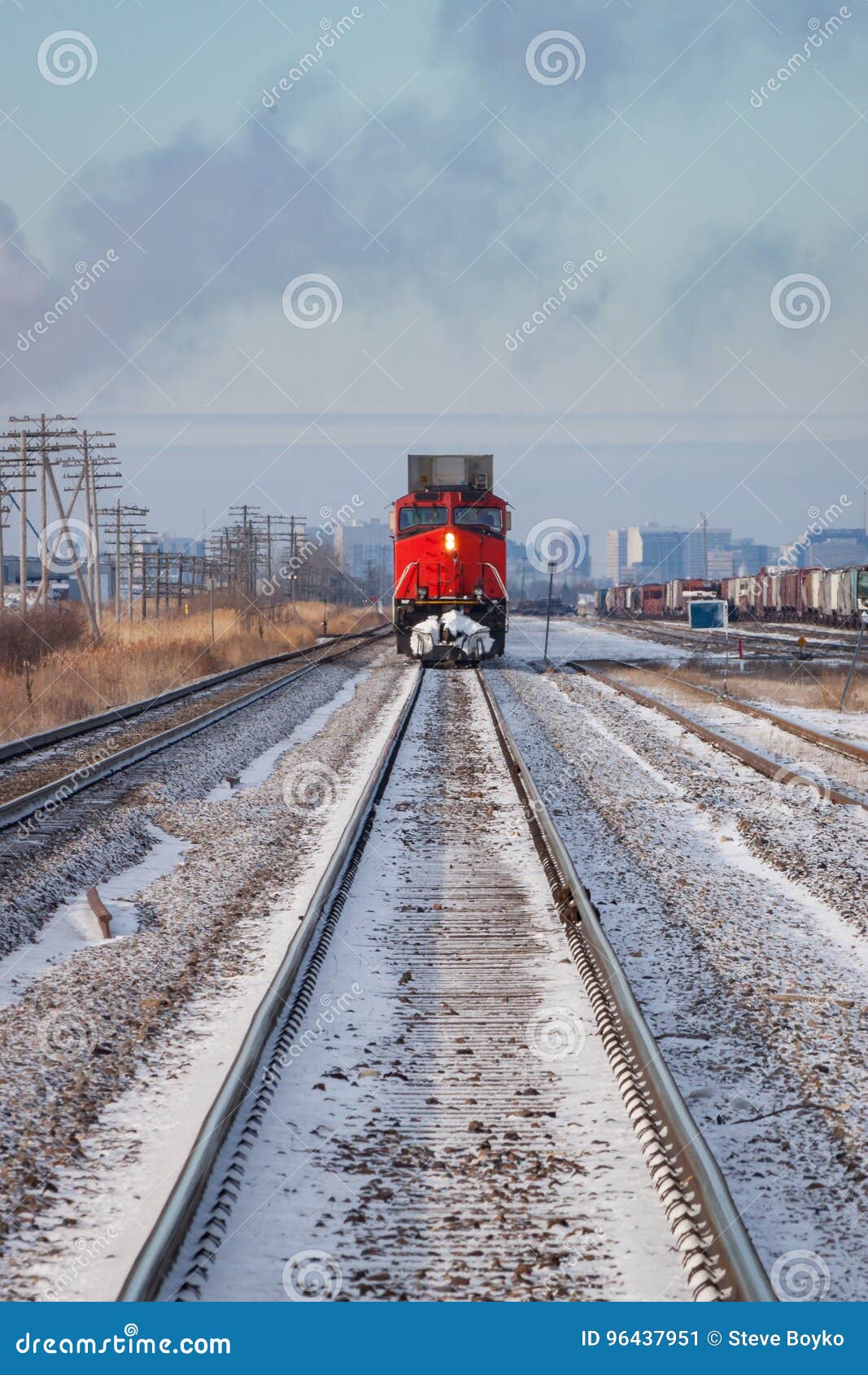 Head on View of Distant Red Train with City Skyline Editorial Photo ...