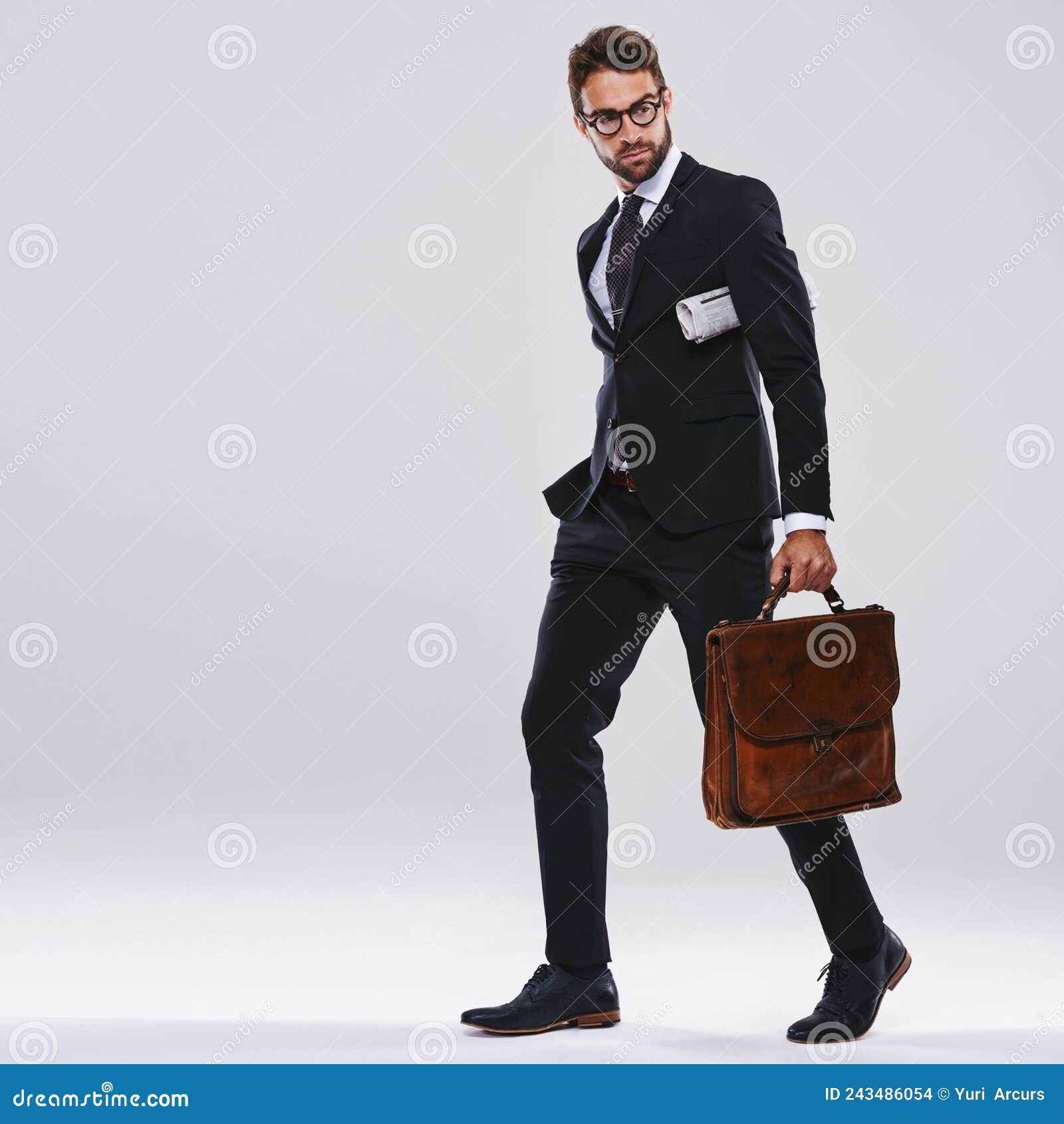 Headed To Work. Studio Shot of a Handsome and Well-dressed Young Man ...