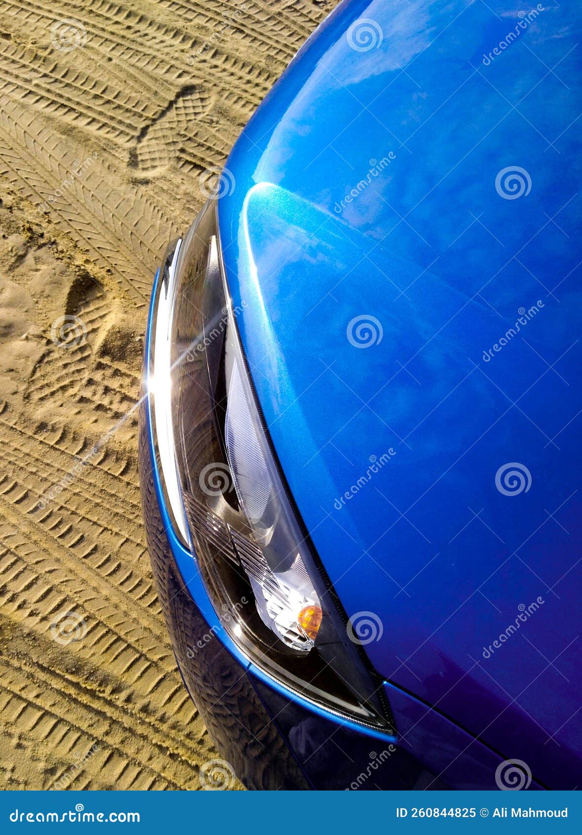 Headlight of a Blue Car on Sand Way and Tire Pattern Stock Image ...