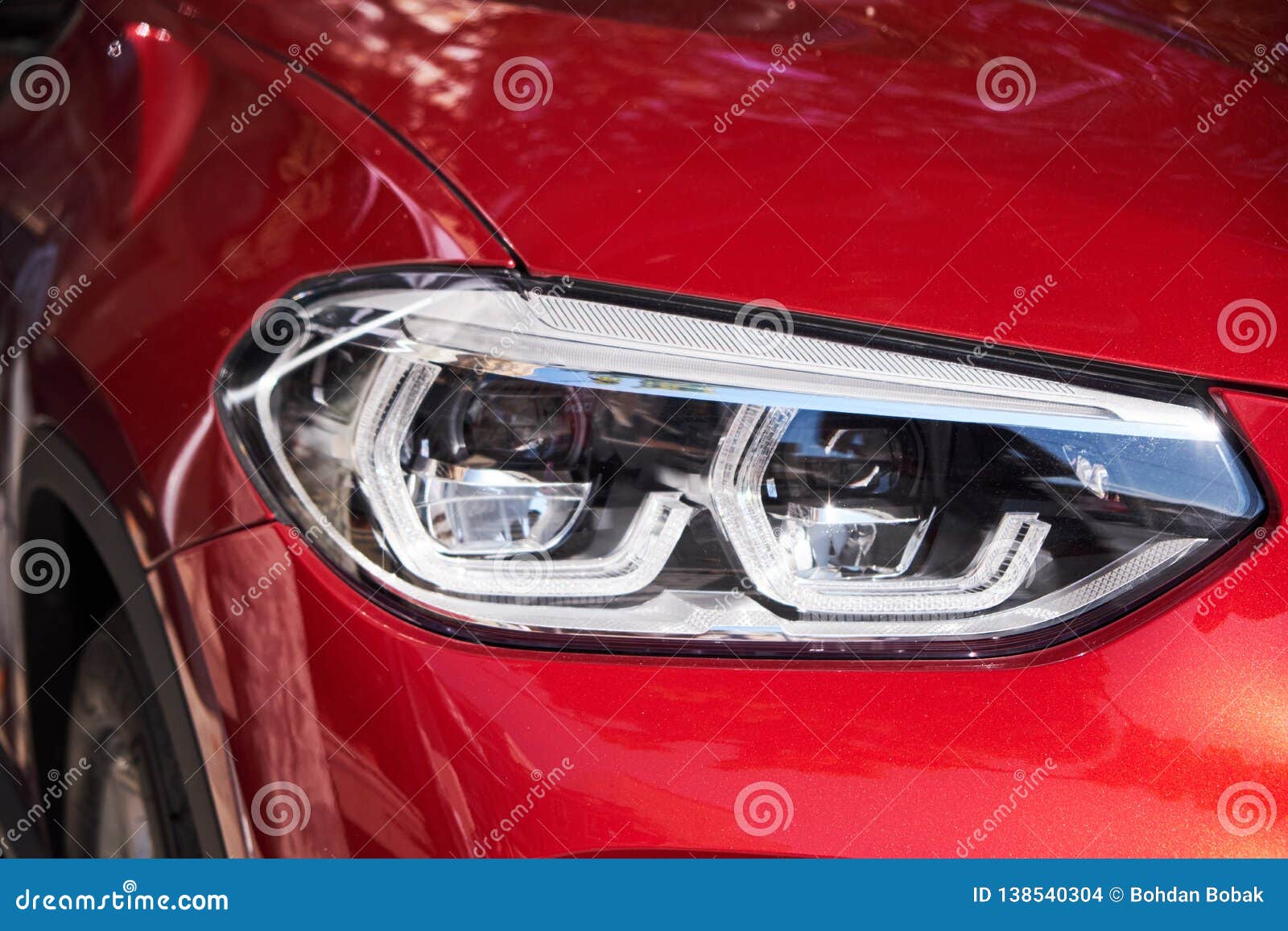 Headlights of red car stock photo. Image of reflection - 138540304