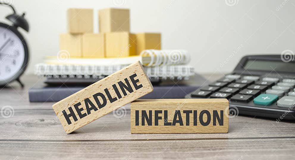 Headline Inflation on the Work Table and Alarm Clock. Stock Photo ...