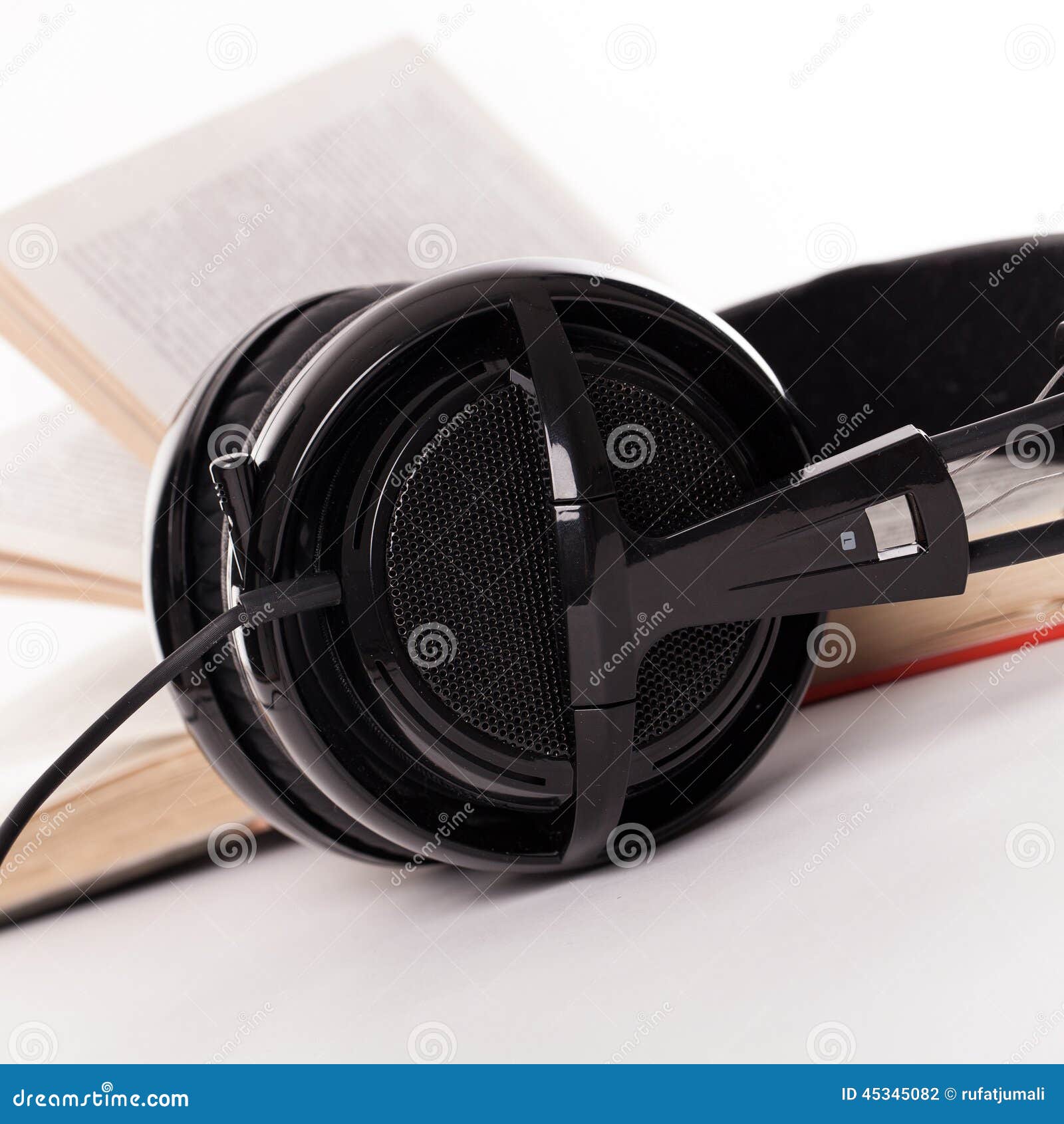 Headphones and Book on a White Background Stock Photo - Image of ...