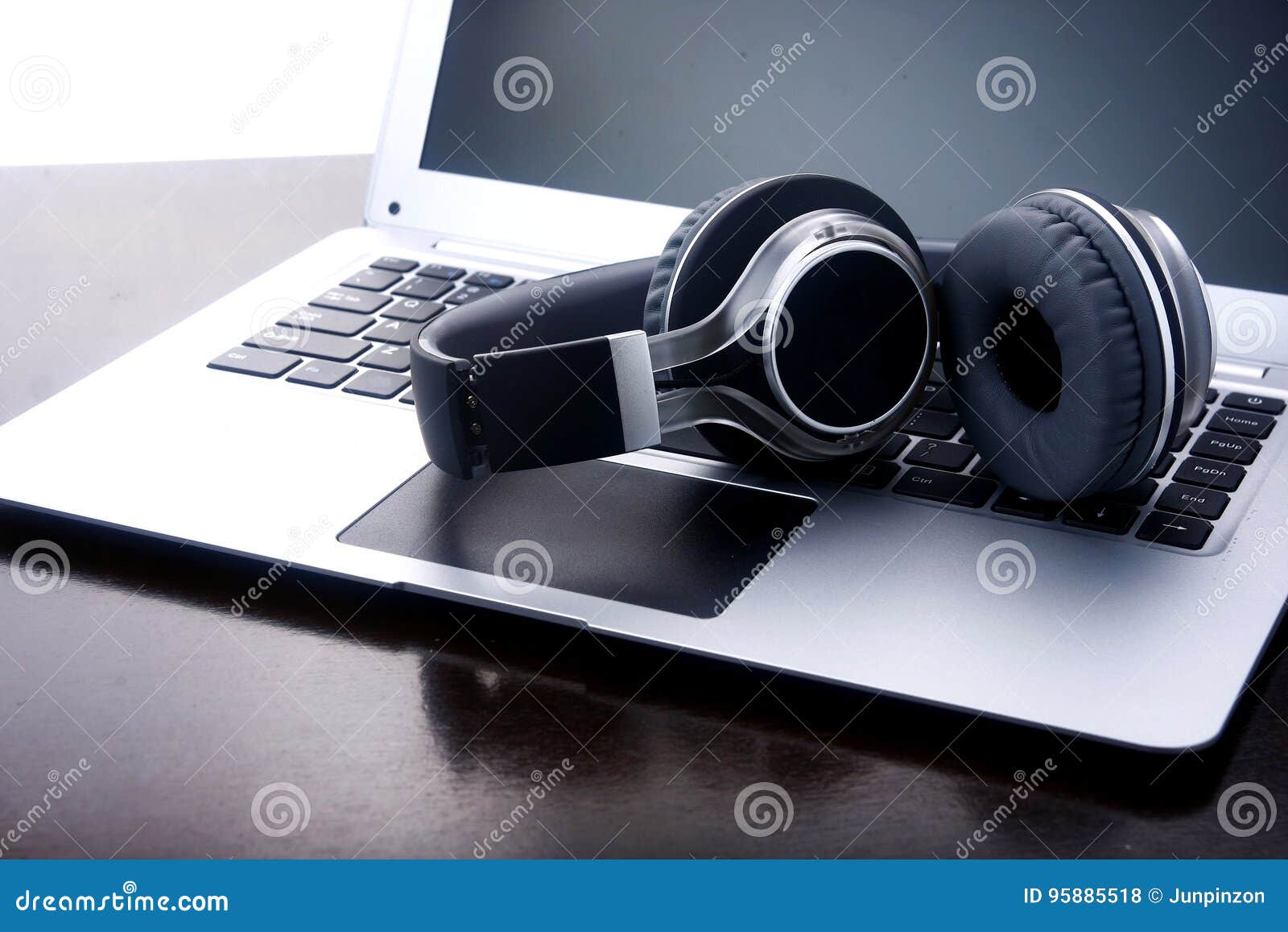 Headphones on a Laptop Computer. Stock Photo - Image of earphones ...