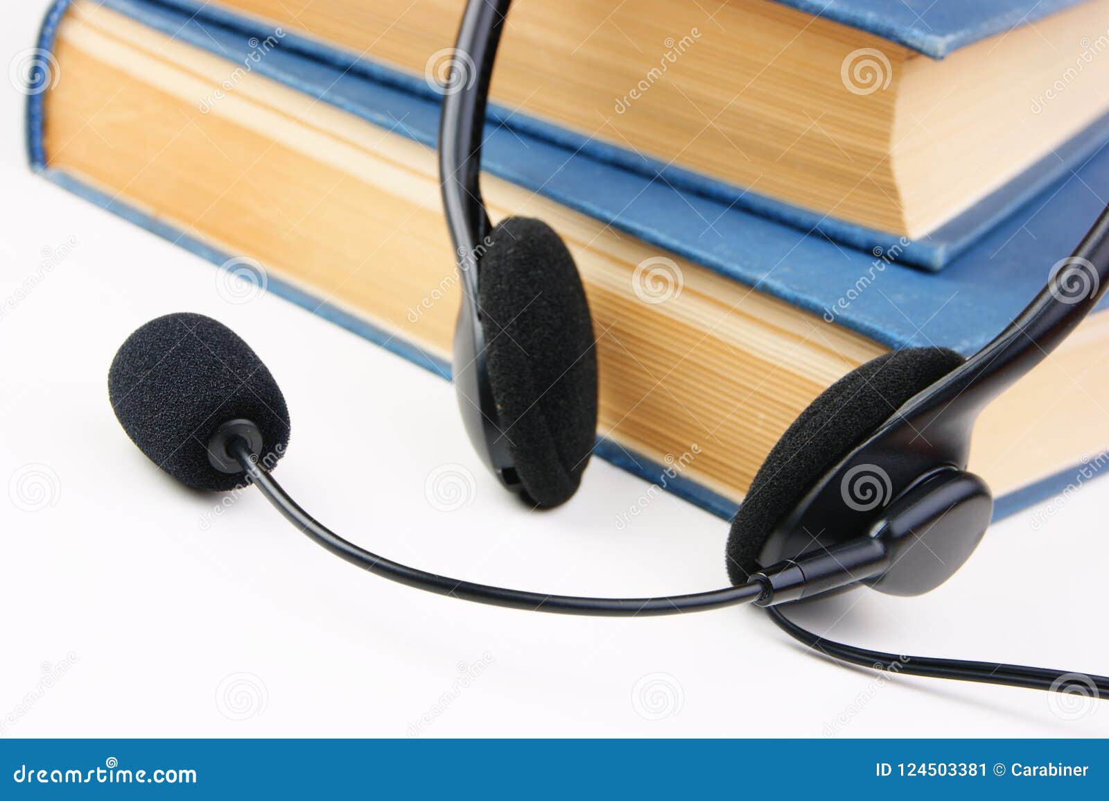 Headphones with a Microphone and Books Stock Image - Image of stack ...