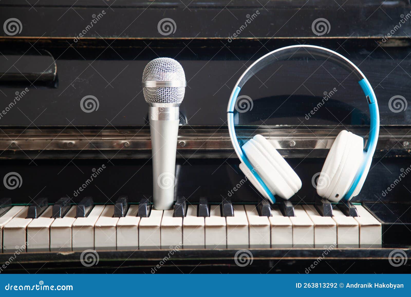 Headphones with a Microphone on the Piano Keyboard. Music Stock Photo ...