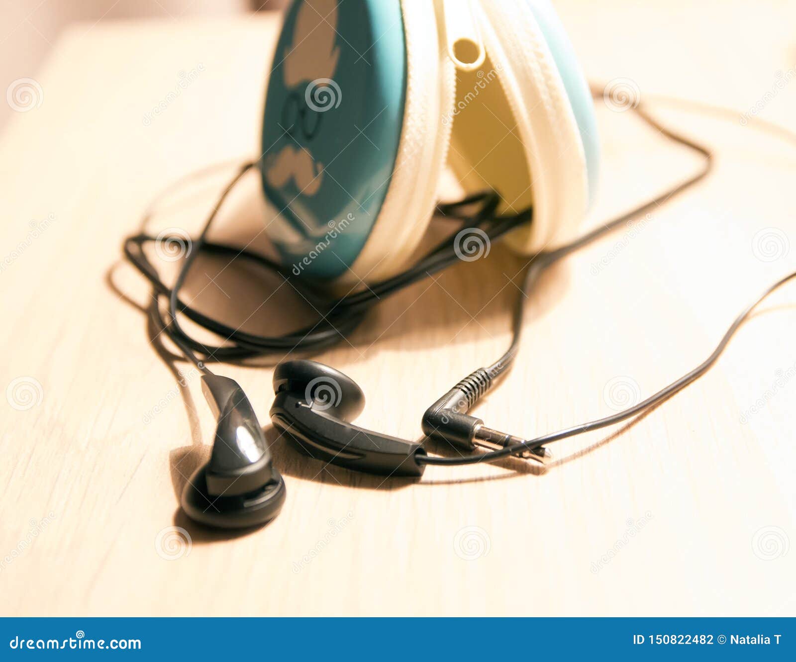 Headphones with Wires on the Table, with, a Case for Headphones Stock ...