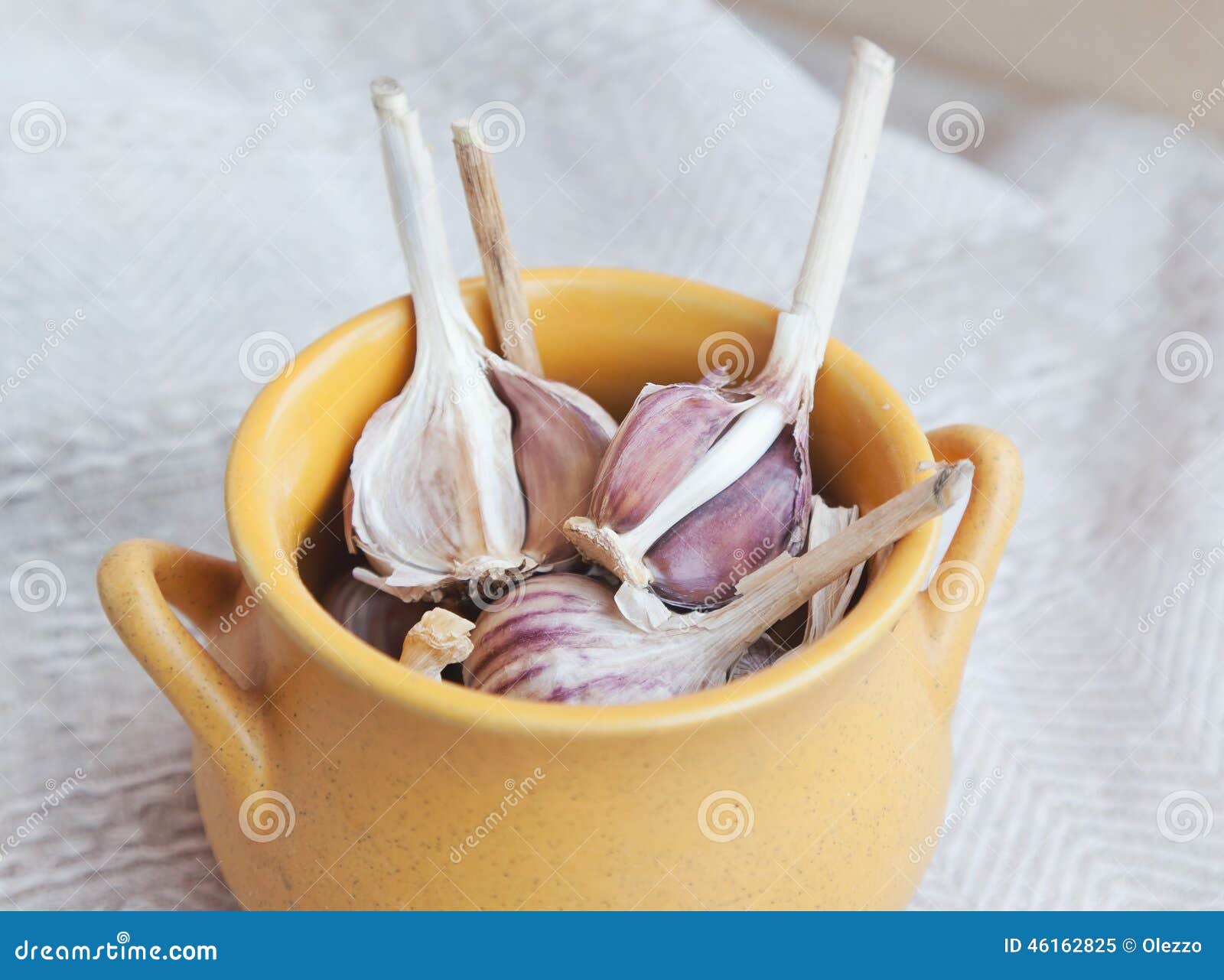 Heads of garlic in a bowl stock image. Image of cooking - 46162825