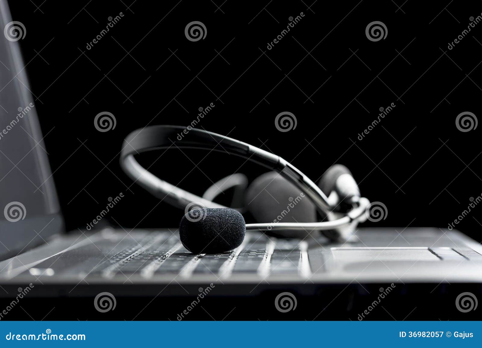 Headset Lying on a Laptop Computer Stock Image - Image of microphone ...