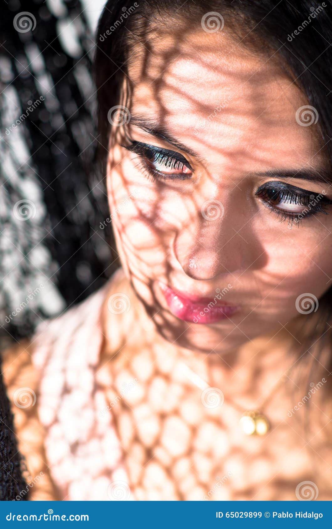Headshot Brunette Model Using Patterned Shadows As Stock Image - Image ...