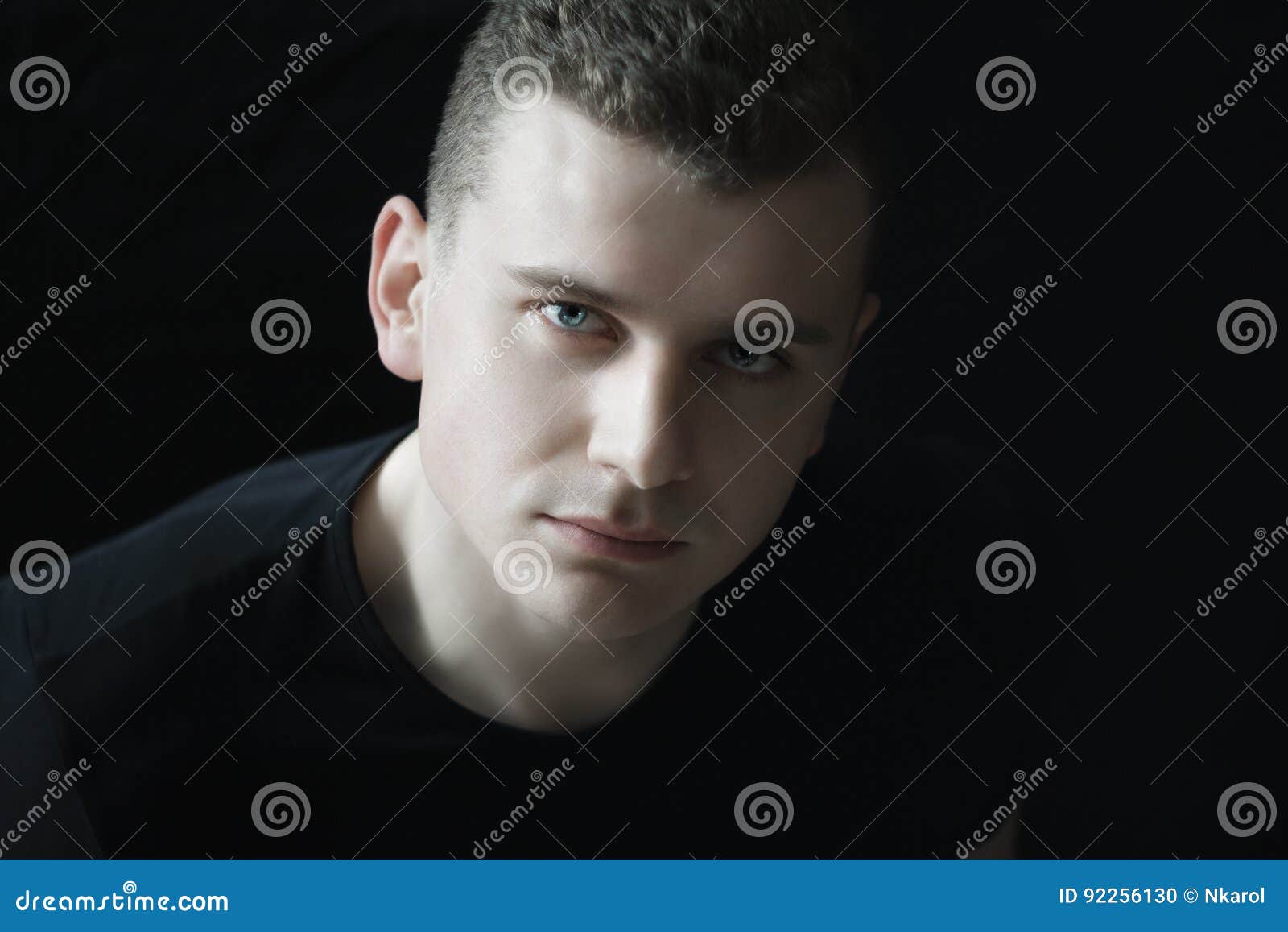 Headshot of Confident Young Man Looking at Camera in Low-key Lighting ...