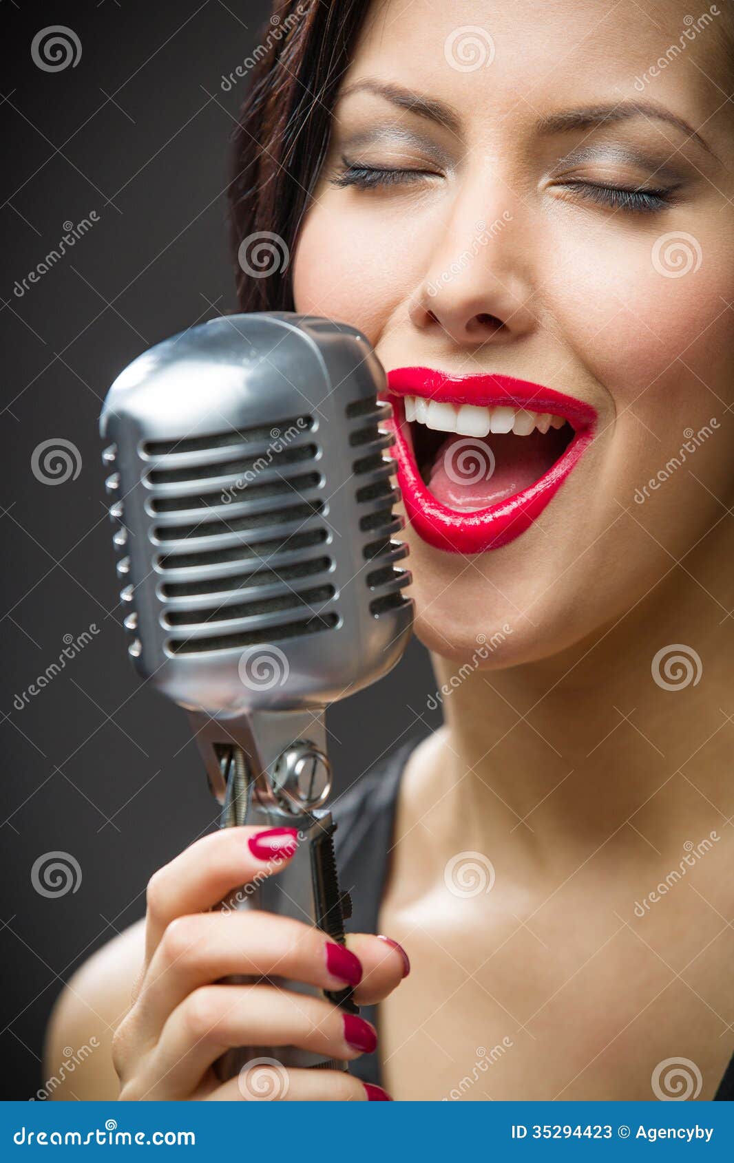 Headshot of Female Singer with Closed Eyes Keeping Microphone Stock ...
