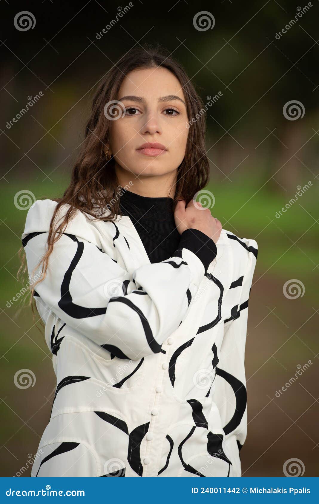 Headshot Portrait Of A Young Woman With Long Hair Wearing Black And