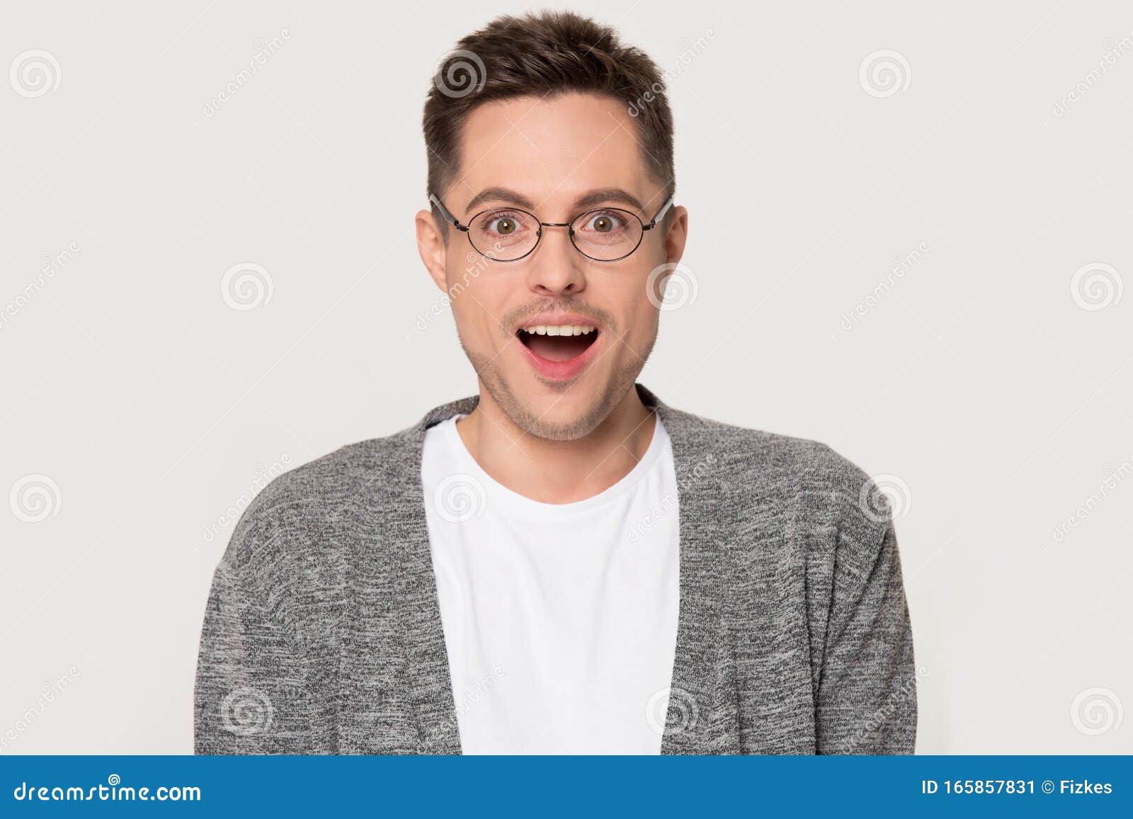 Headshot Of Surprised Millennial Man With Opened Mouth From Wonder