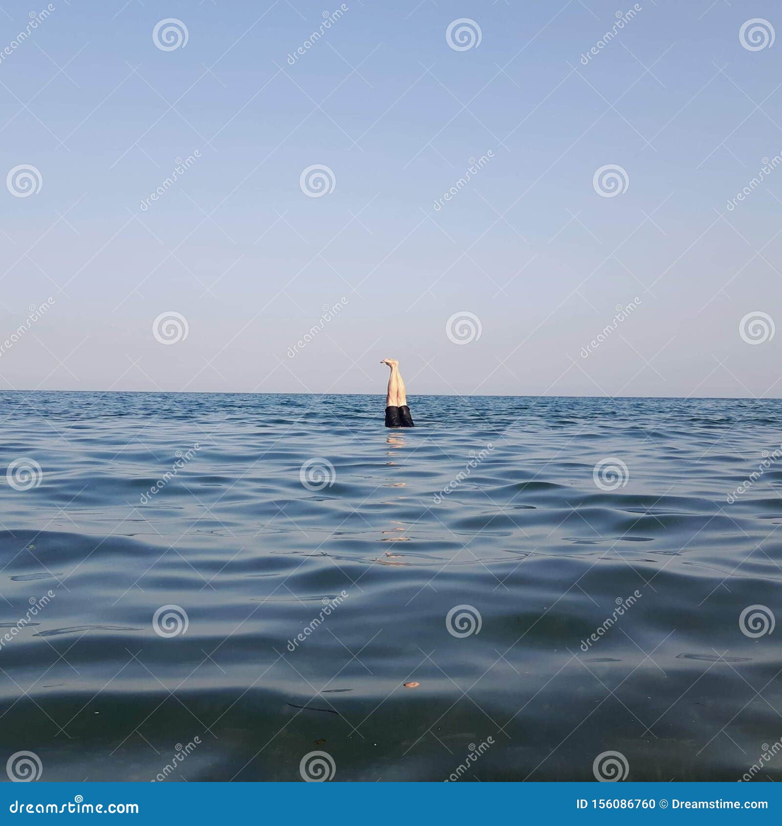 Headstand in the sea stock photo. Image of water, headstand - 156086760