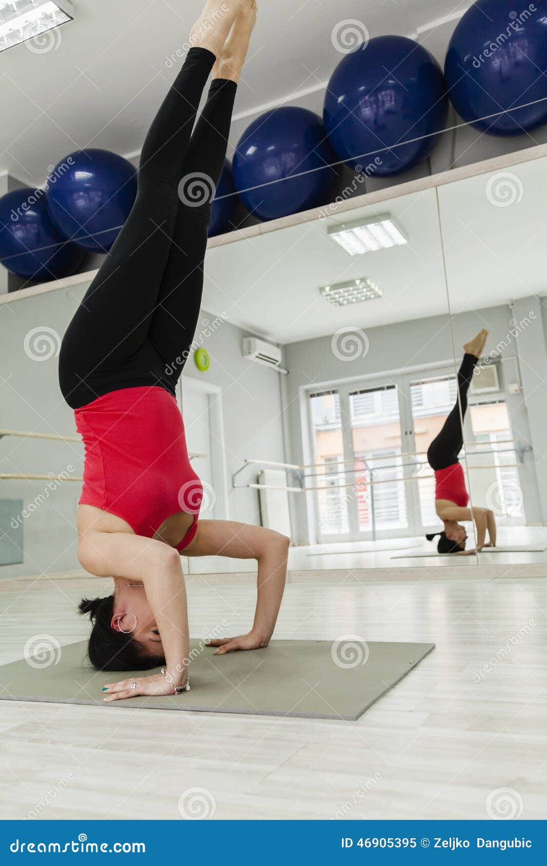 Headstand stock image. Image of beauty, clothing, reflection - 46905395