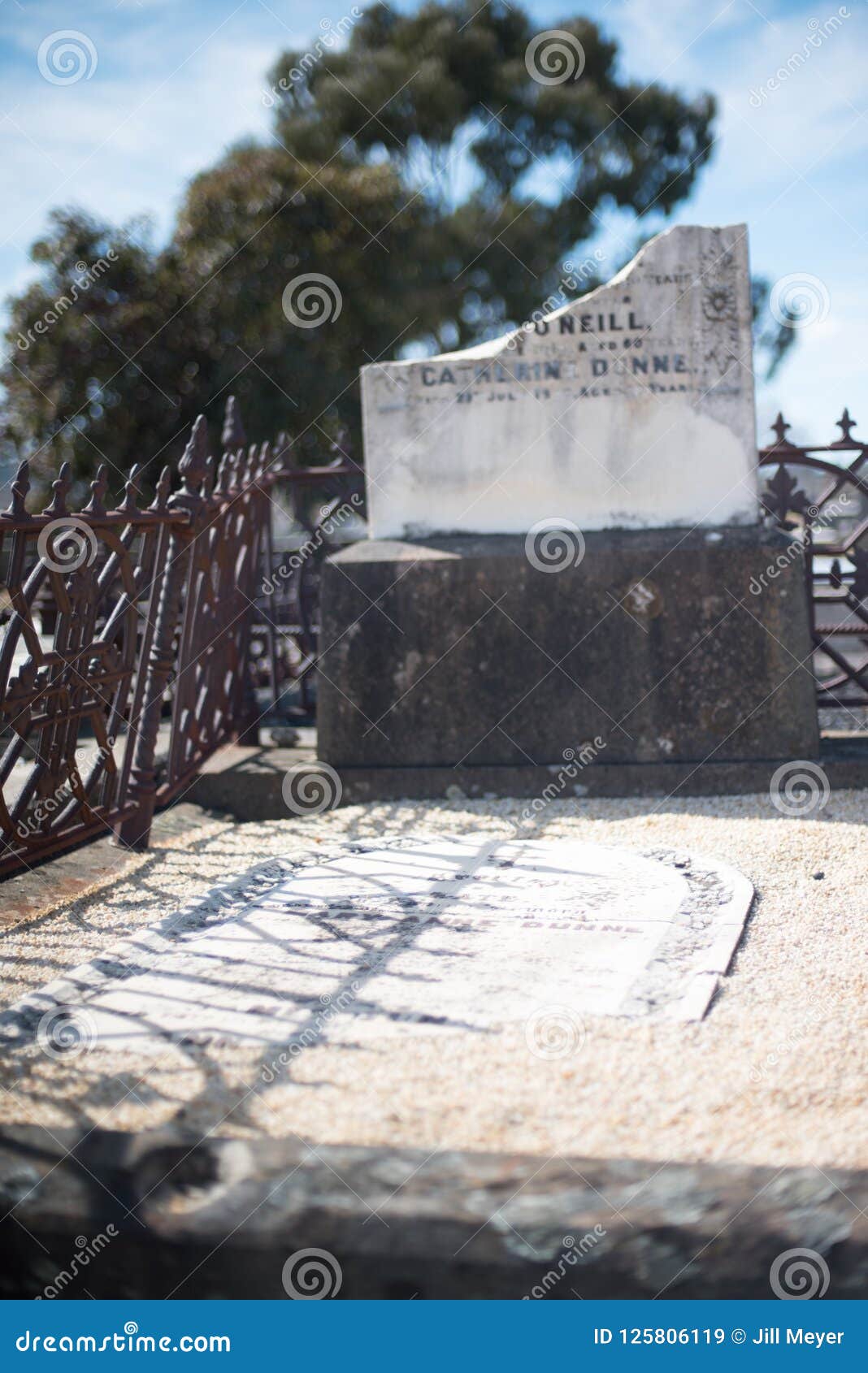 Headstone in a cemetery stock image. Image of sunlit - 125806119