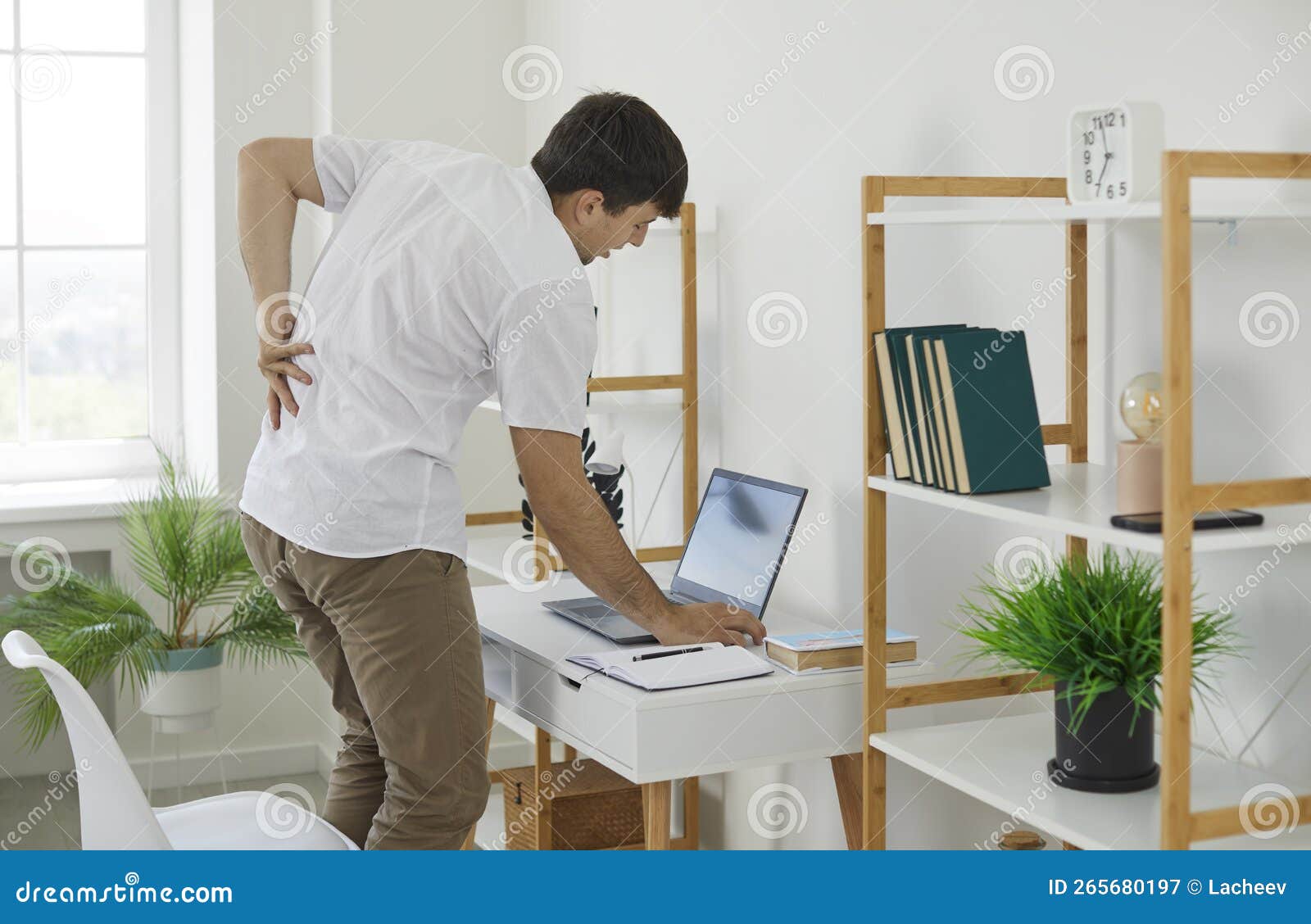 Man Has Sharp Pain in Lower Back after Working for Long Time with ...