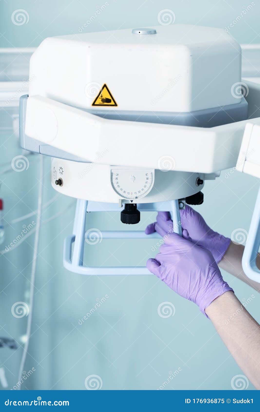 Health Worker with Gloved Hands Adjusts an X-ray Machine Stock Image ...