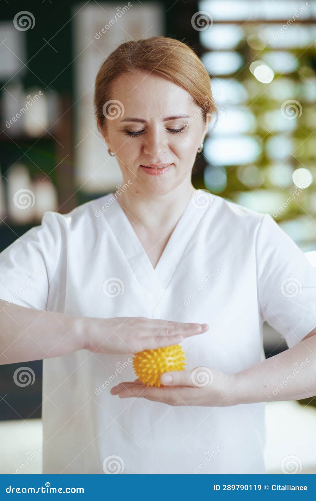 Massage Therapist Woman In Spa Salon With Massage Ball Stock Image