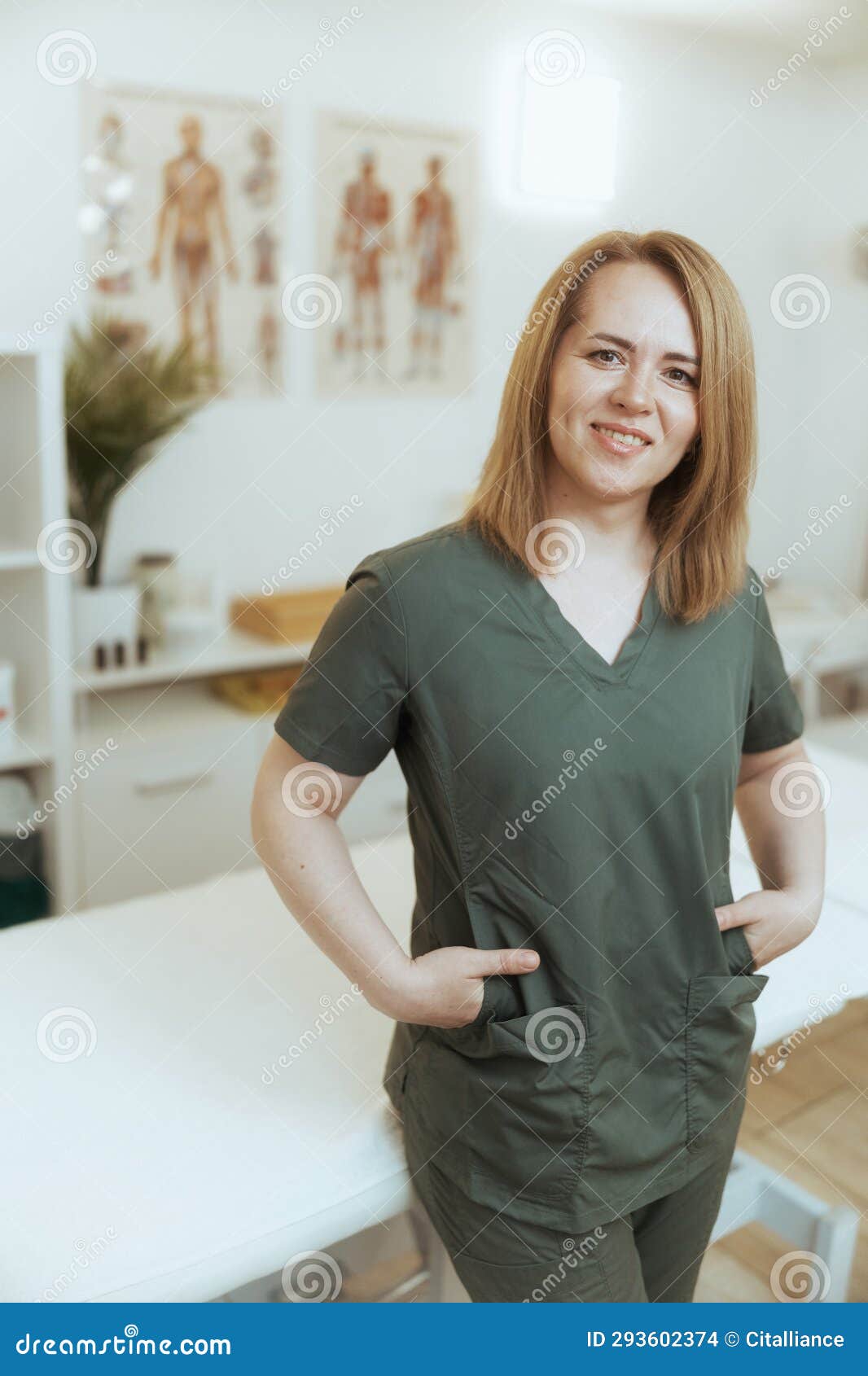 Massage Therapist Woman In Massage Cabinet Looking At Camera Stock
