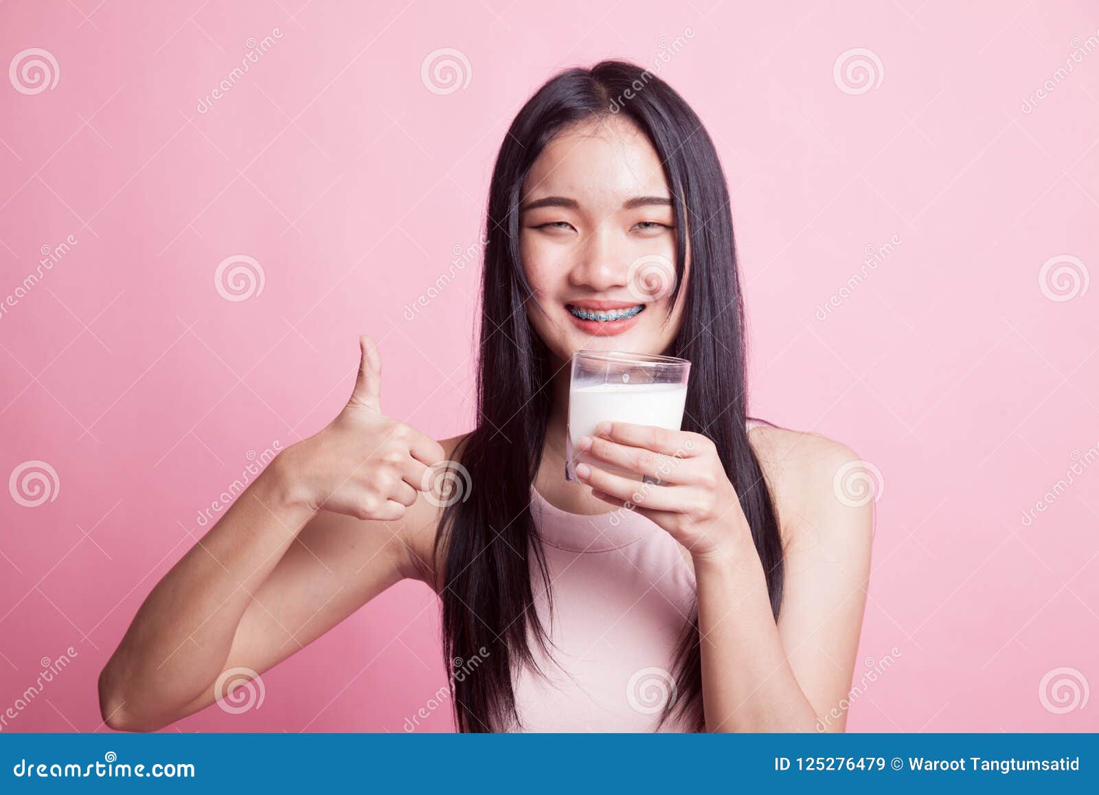 Healthy Asian Woman Drinking A Glass Of Milk Thumbs Up Stock Image