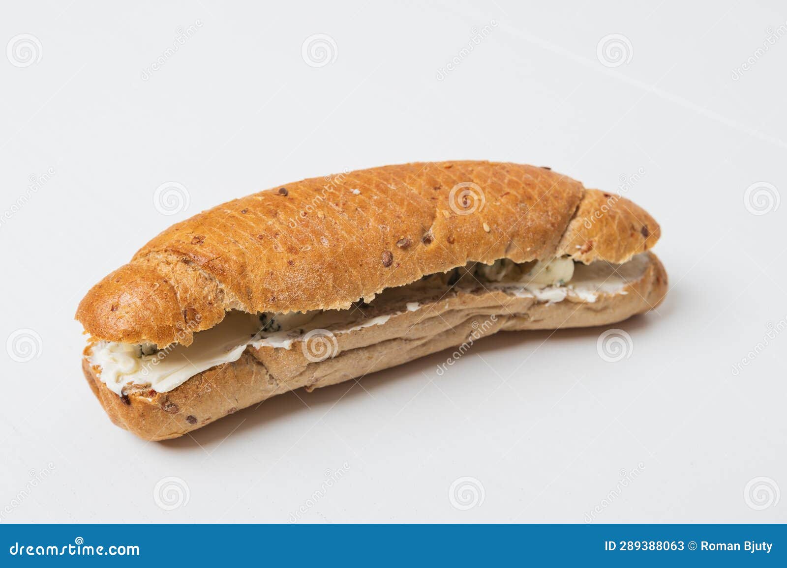 A Healthy Cereal Roll Spread with Cheese for a Snack. the Roll is on a ...