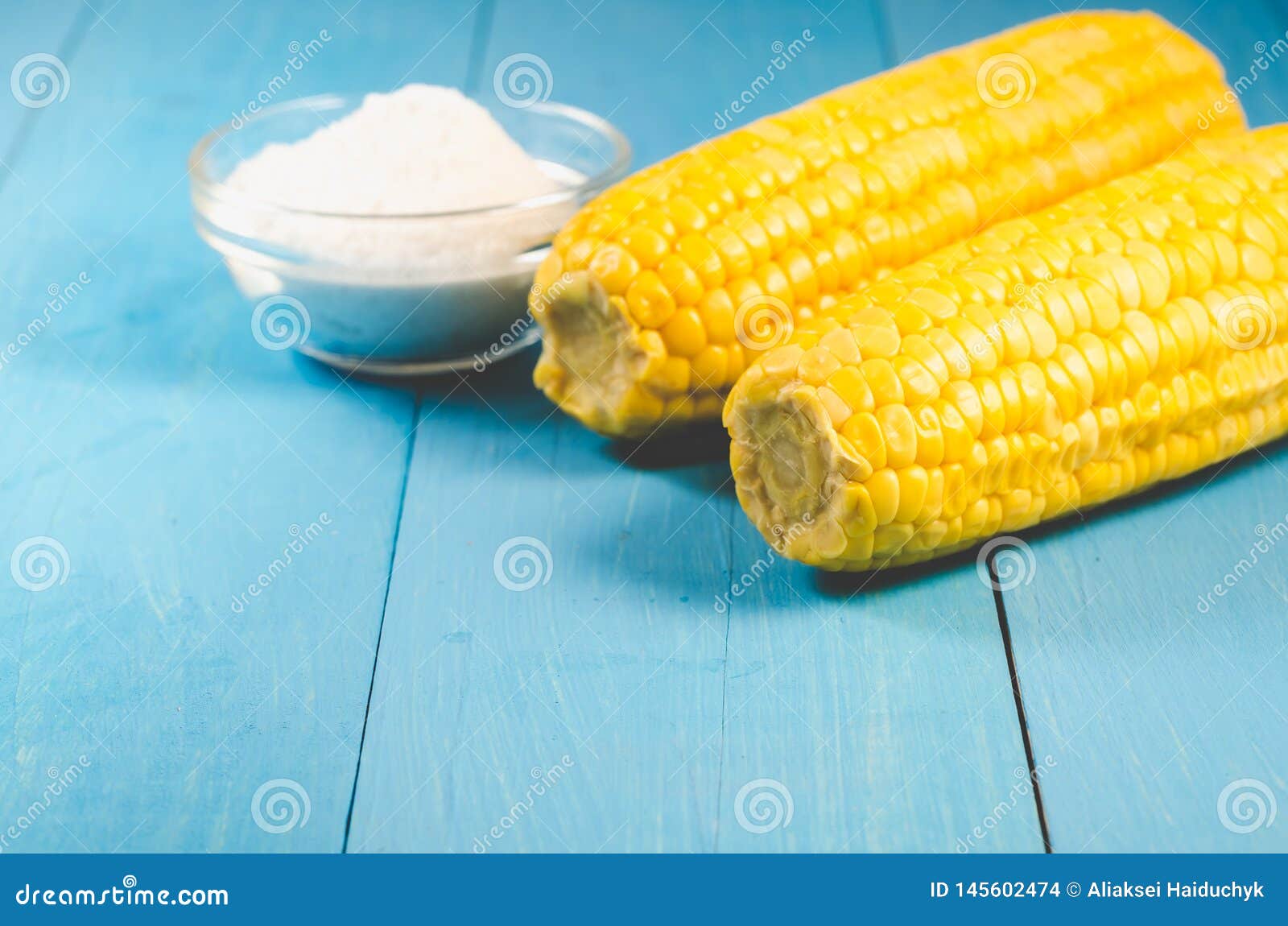 Healthy Food. Appetizing Boiled Corn with Salt on a Blue Background ...