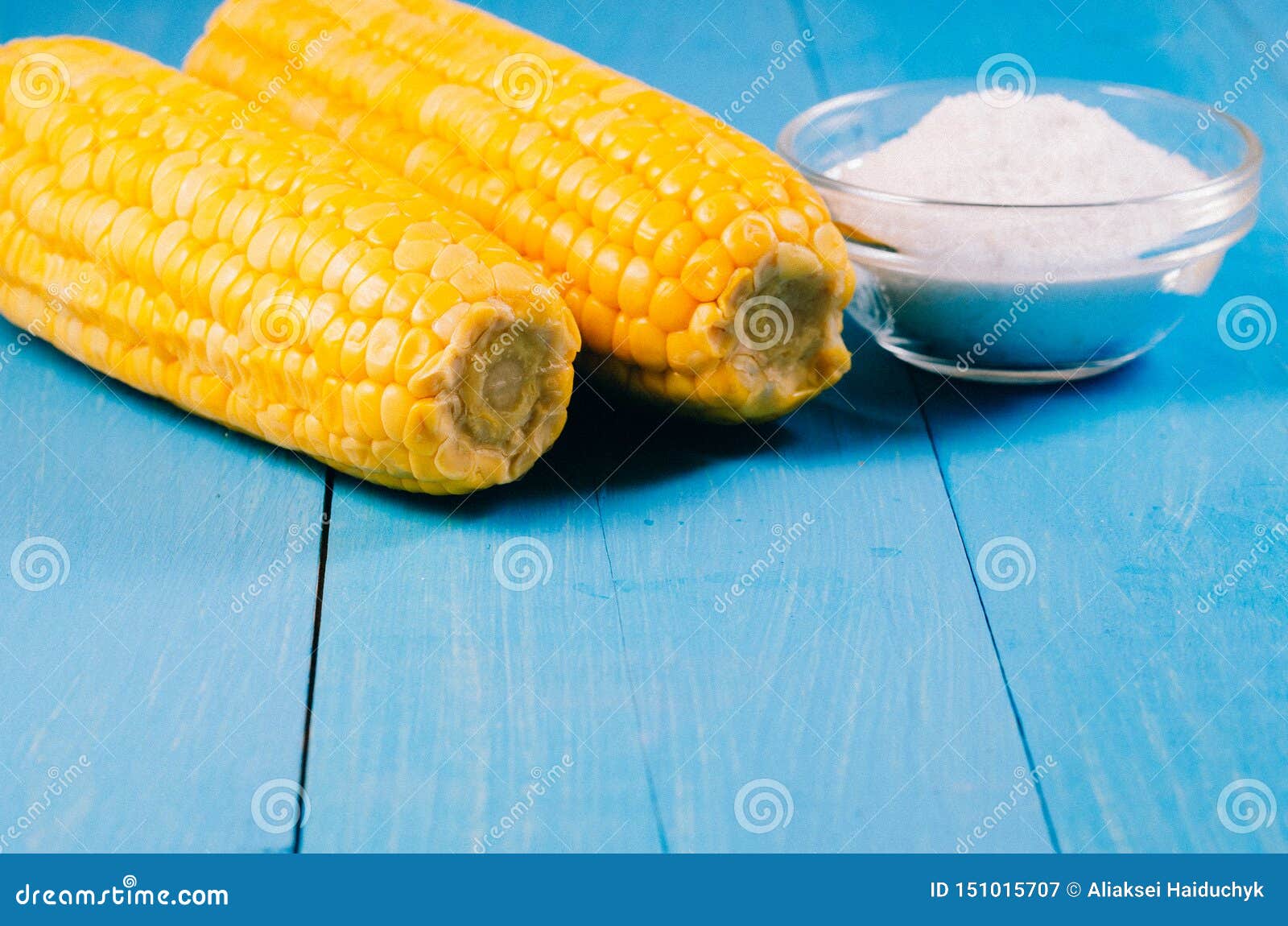 Healthy Food. Appetizing Boiled Corn with Salt on a Blue Background ...