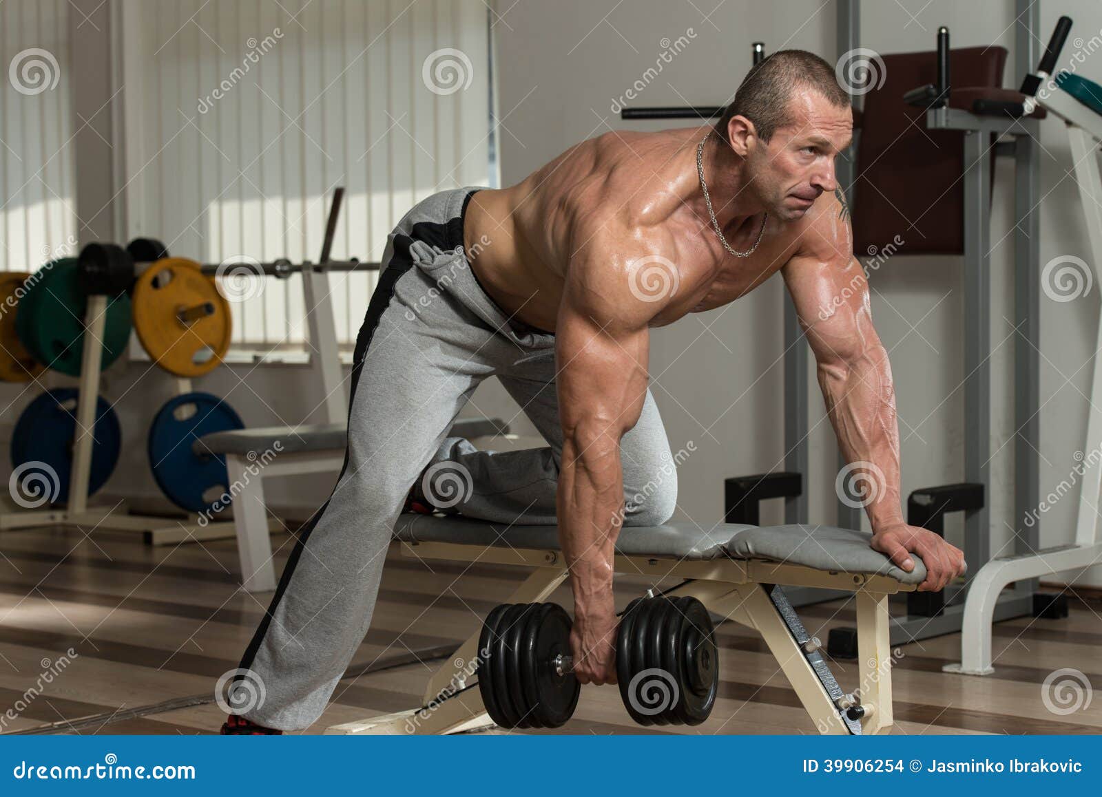 Healthy Man Doing Back Exercises with Dumbbell Stock Photo - Image of ...