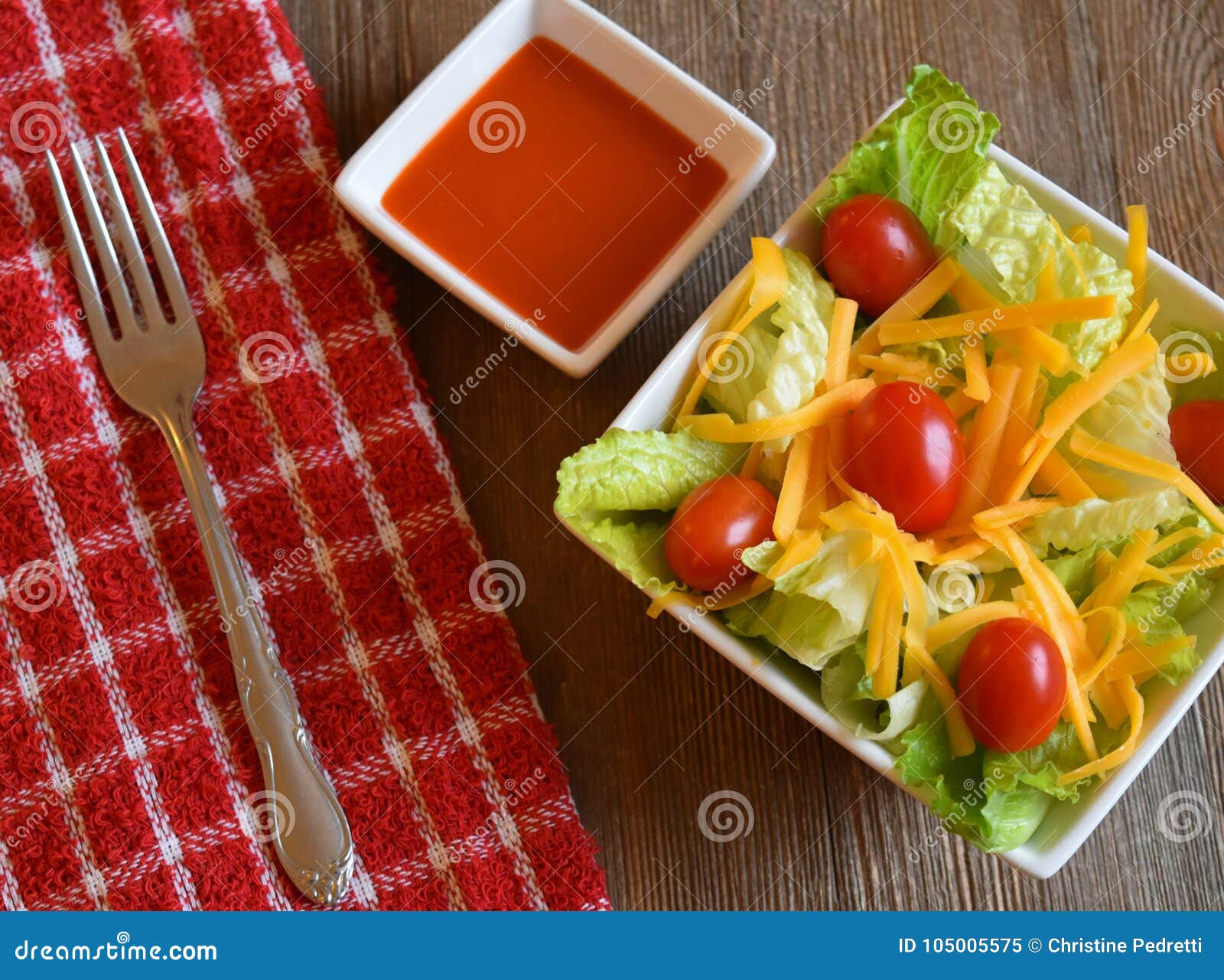 Healthy Salad and a Side of Dressing on a Wood Background Stock Image ...
