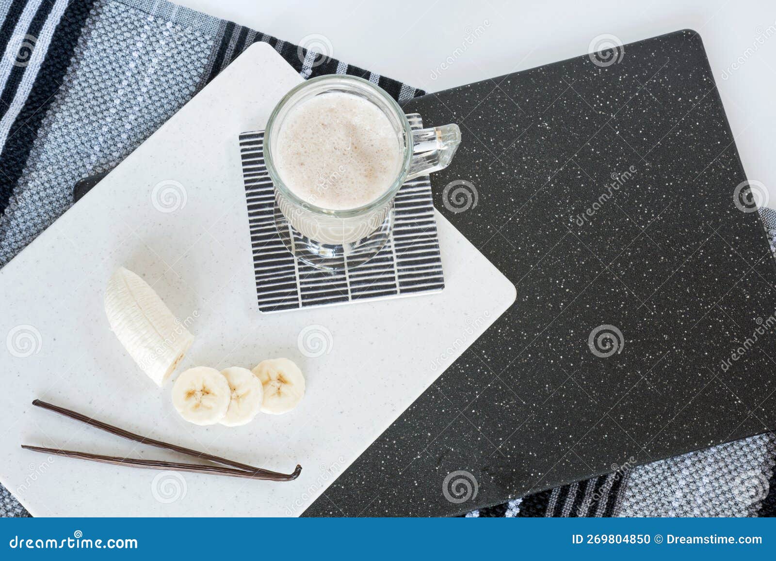 Vanilla Banana Smoothie With Banana And Vanilla Bean On Neutral