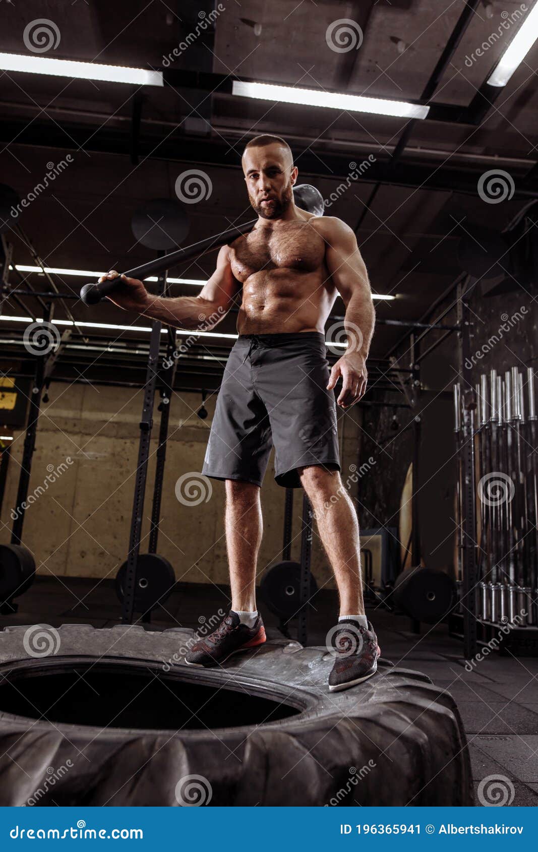 Well-built Guy is Standing on the Wheel and Looking at the Camera Stock ...
